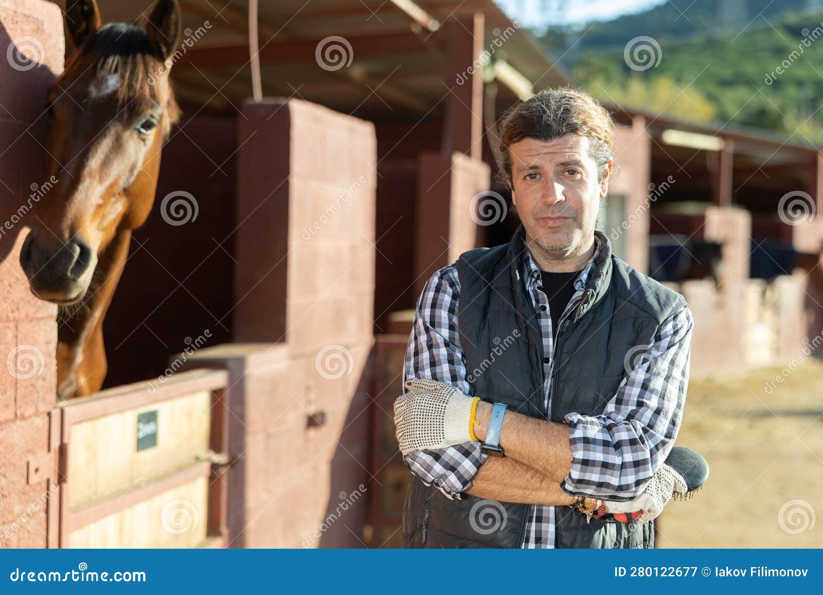 Confident Man in Front of His Farm and Stables with Horses Stock Image ...