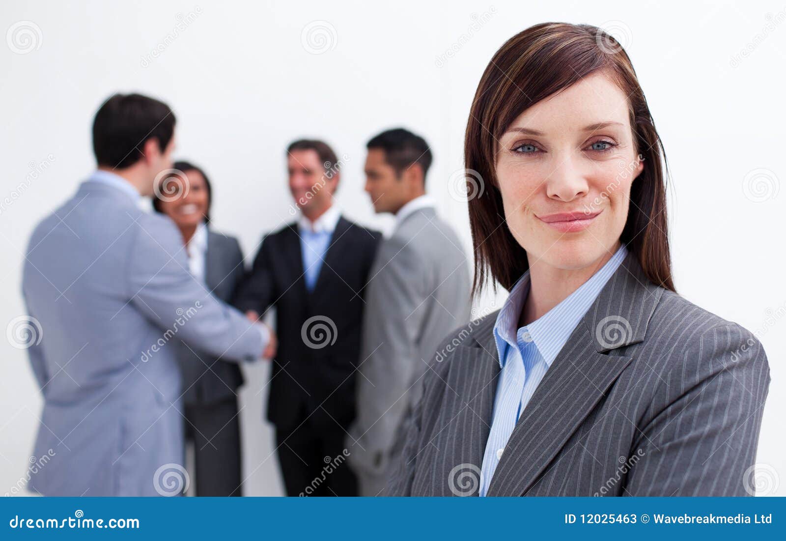 Confident Manager with Her Team in the Background Stock Image - Image ...