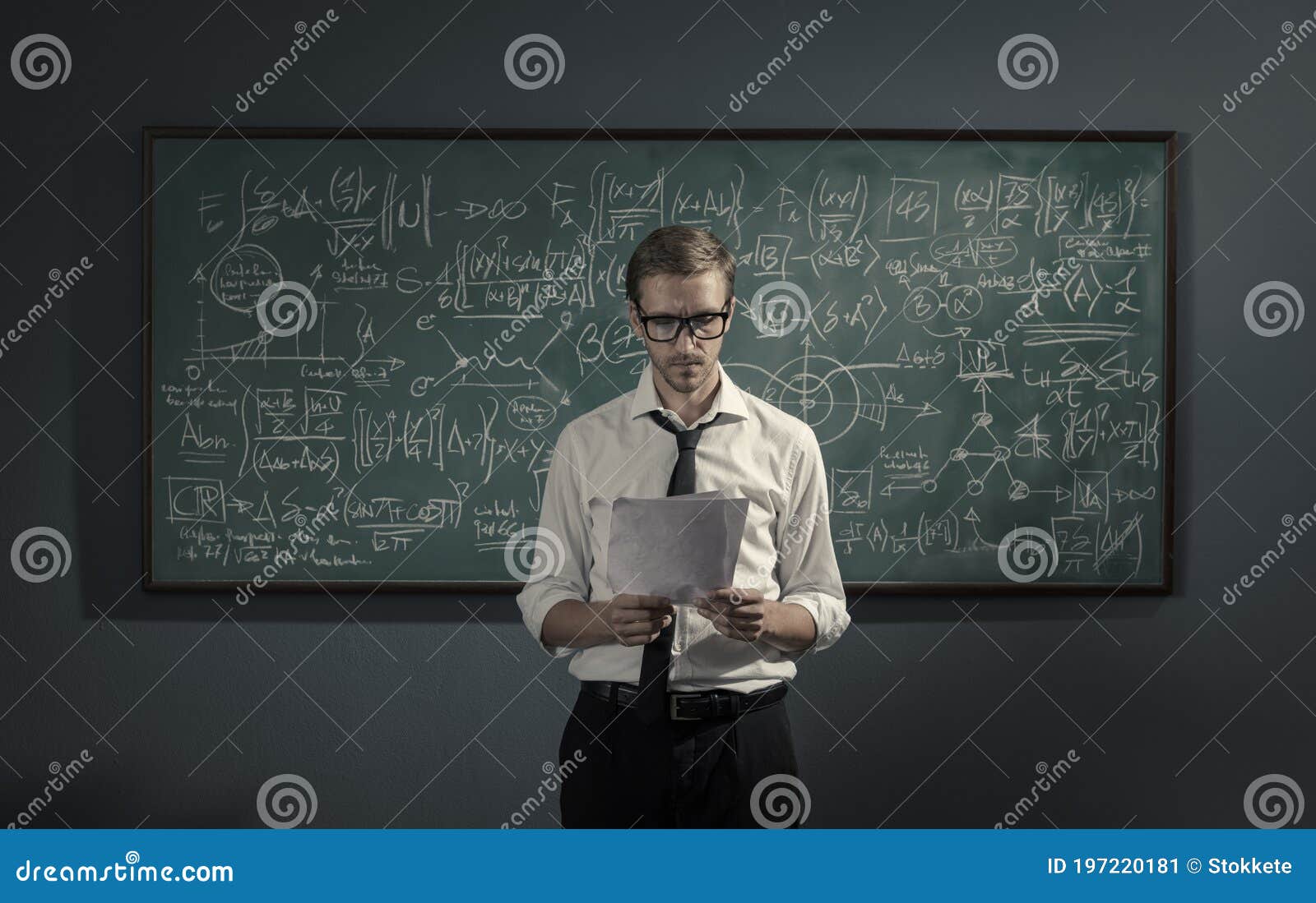 Confident Math Professor Teaching in Front of the Chalkboard Stock ...