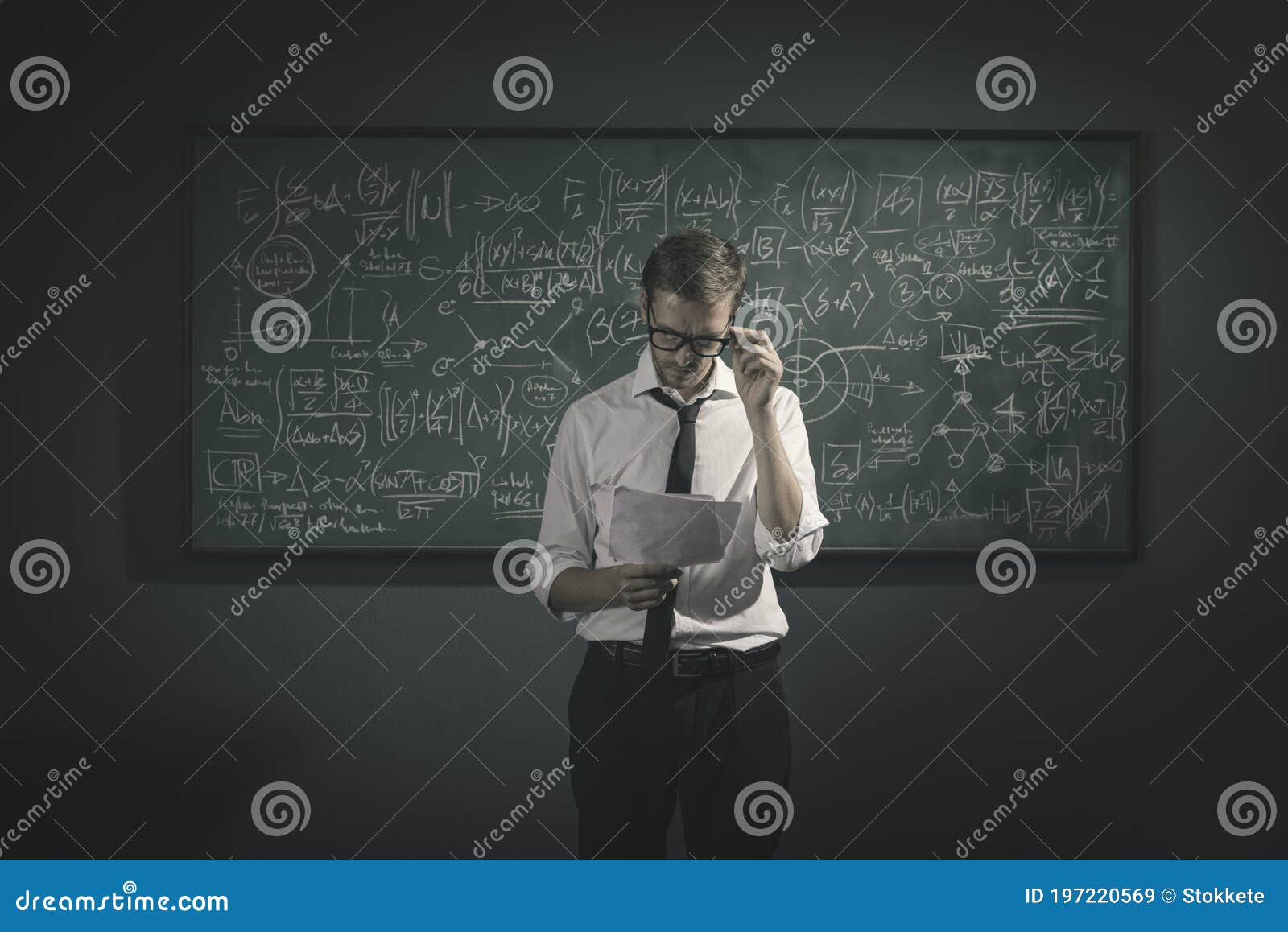Confident Math Professor Teaching in Front of the Chalkboard Stock ...
