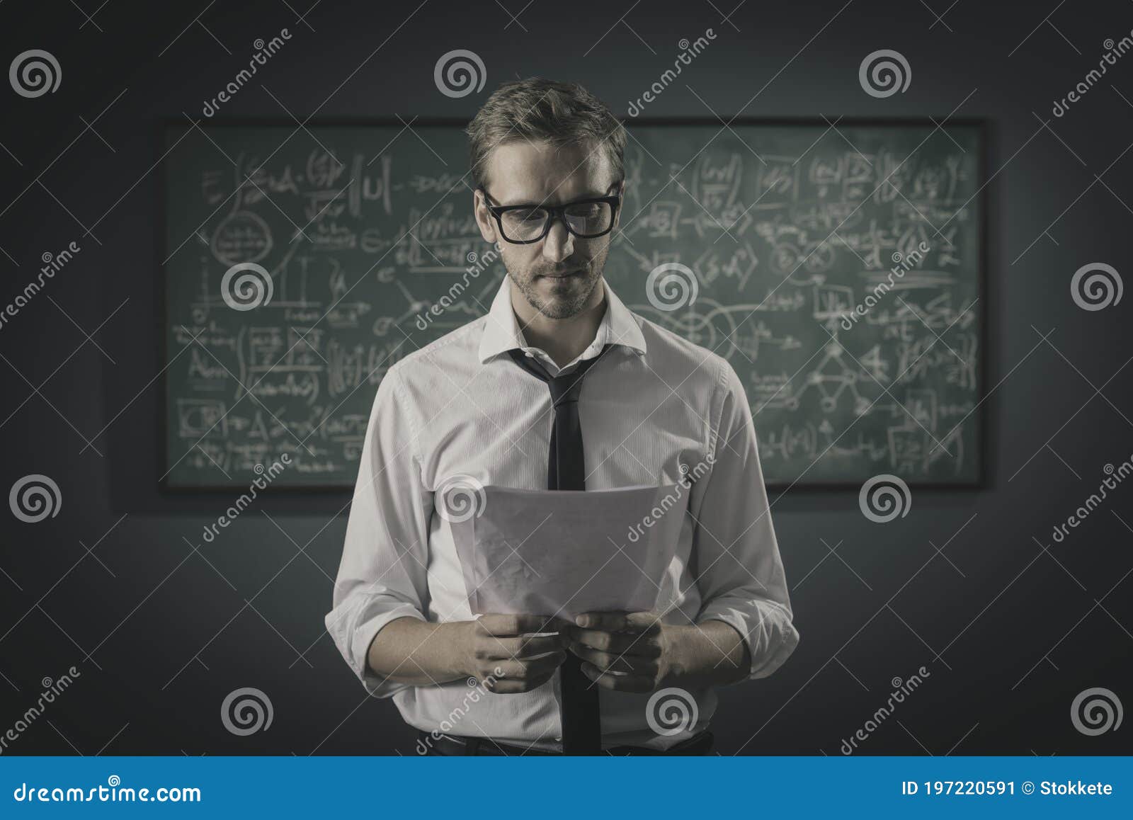 Confident Math Professor Teaching in Front of the Chalkboard Stock ...