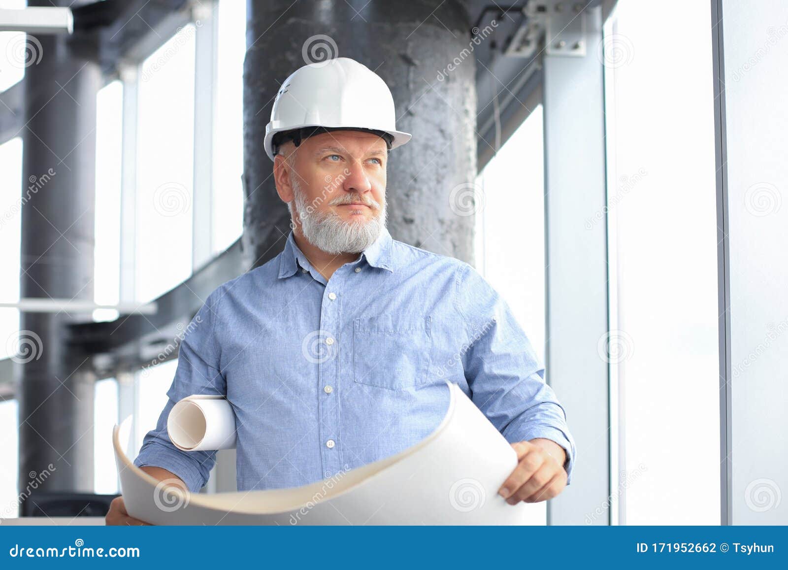 Confident Mature Architect in Corporate Suit and Hardhat Holding a ... Confident Mature Architect in Corporate Suit and Hardhat Holding a ...