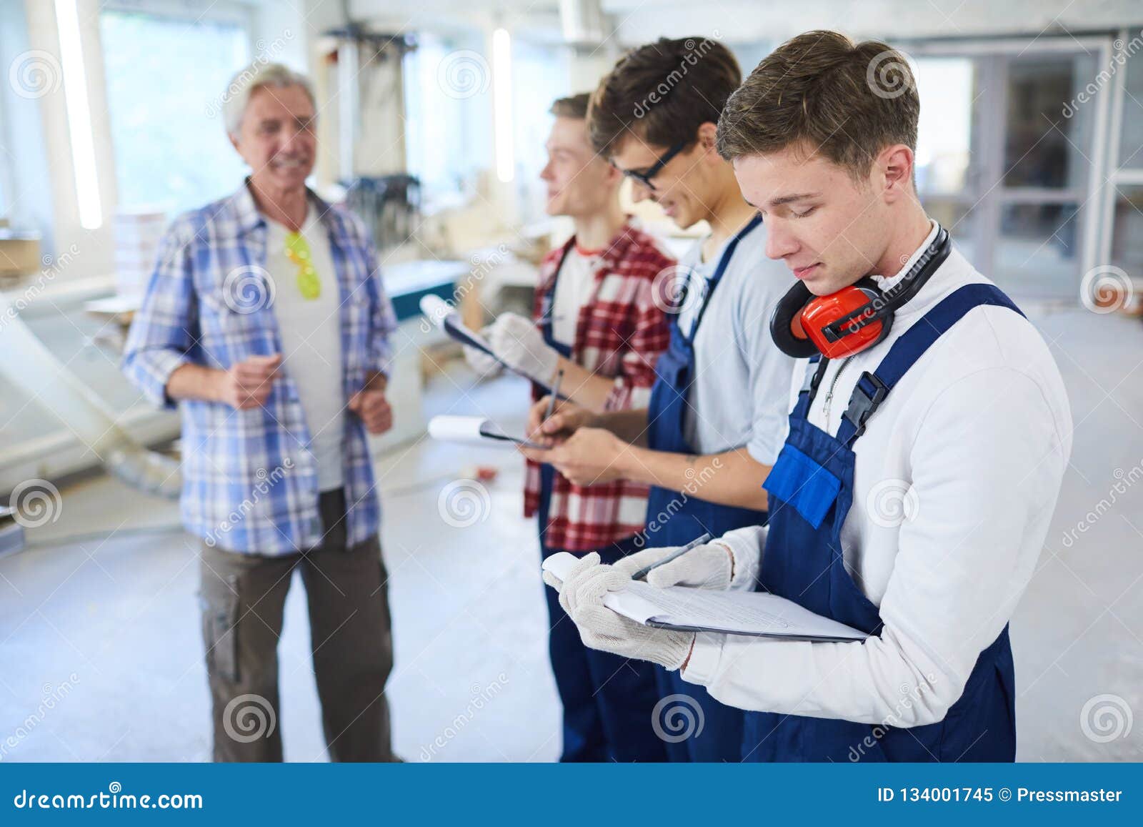 Foreman Explaining Tasks To Workers Stock Image - Image of professional ...