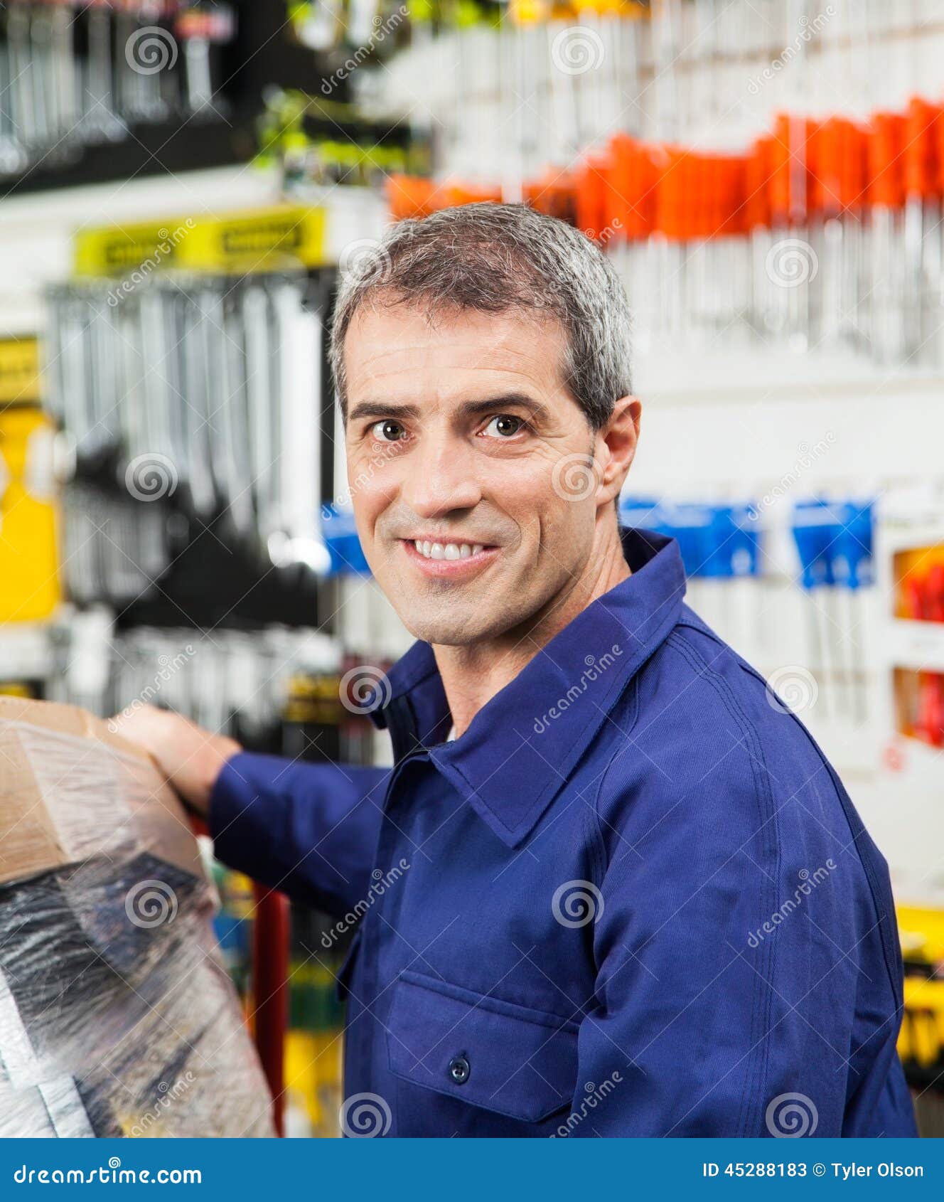 Confident Mature Worker Smiling in Hardware Shop Stock Image - Image of ...