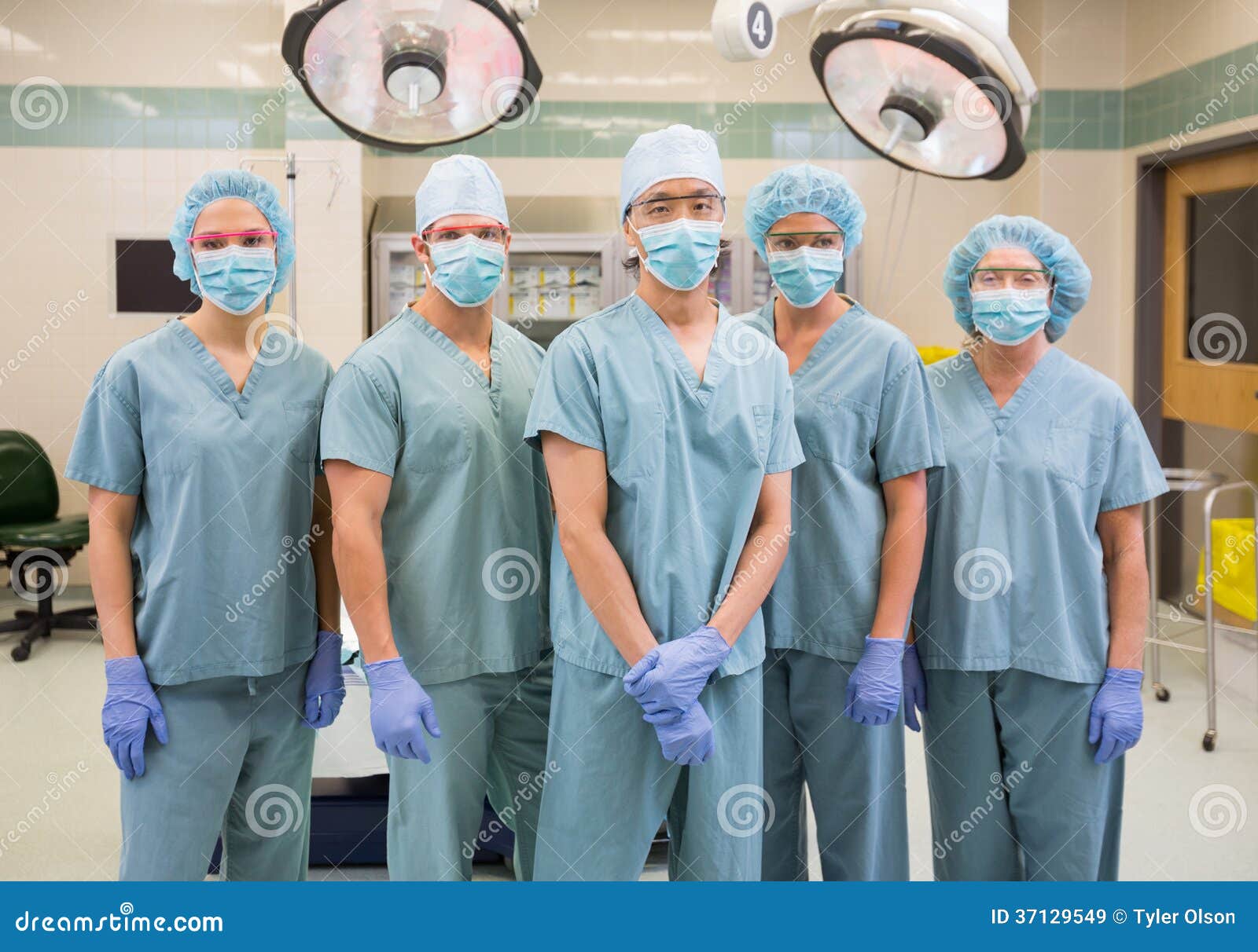 Confident Medical Team Standing in Operation Room Stock Image - Image ... Confident Medical Team Standing in Operation Room Stock Image - Image ...
