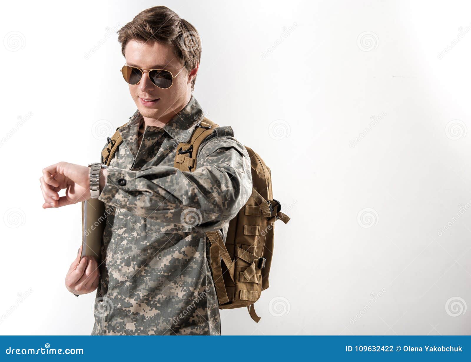 Tranquil Young Soldier Checking Time Stock Photo - Image of hold, glad ...