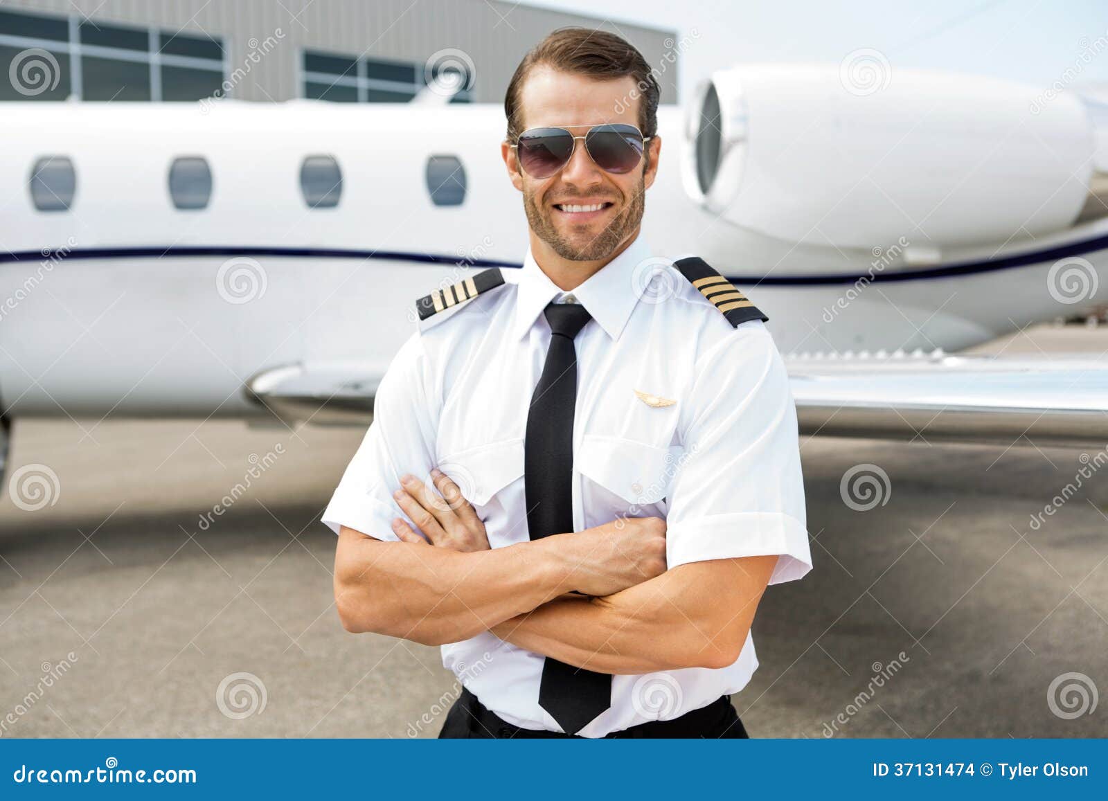 Confident Pilot in Front of Private Jet Stock Photo - Image of arms ...
