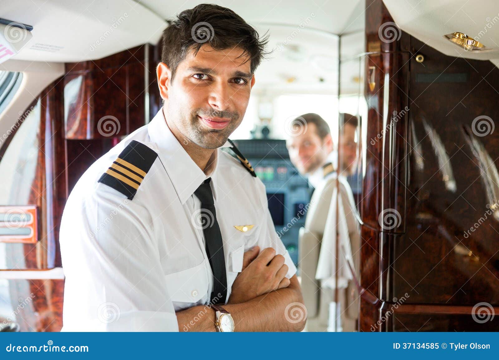 Confident Pilot in Private Jet Stock Image - Image of arms, corporate ...