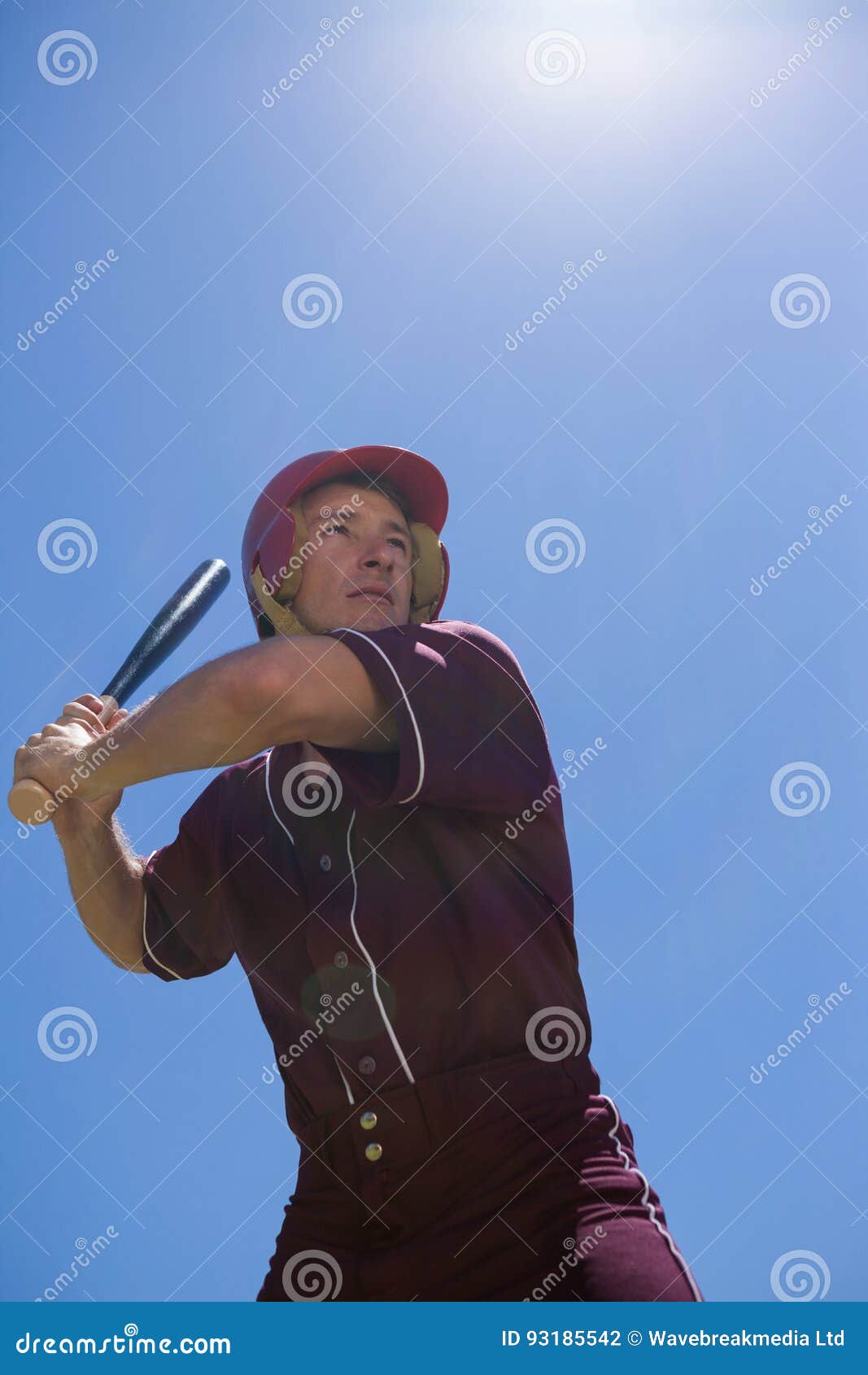 Confident Player with Baseball Bat Against Sky Stock Photo - Image of ...