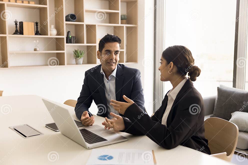 Confident Positive Indian Client and Developer Discussing Online ...