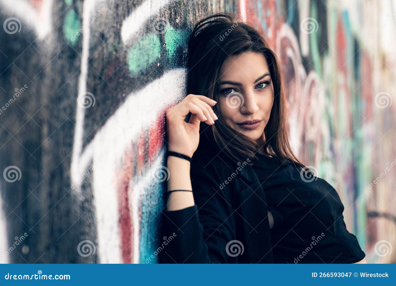 Confident Pretty Female Standing in Front of the Graffiti Wall Stock ...