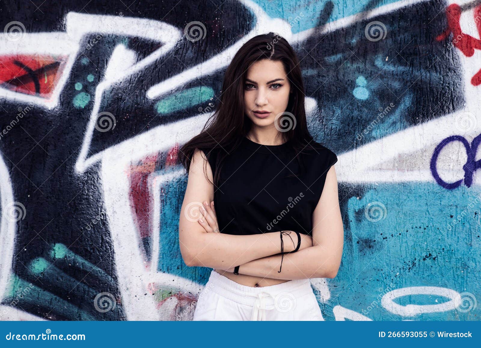 Confident Pretty Female Standing in Front of the Graffiti Wall Stock ...