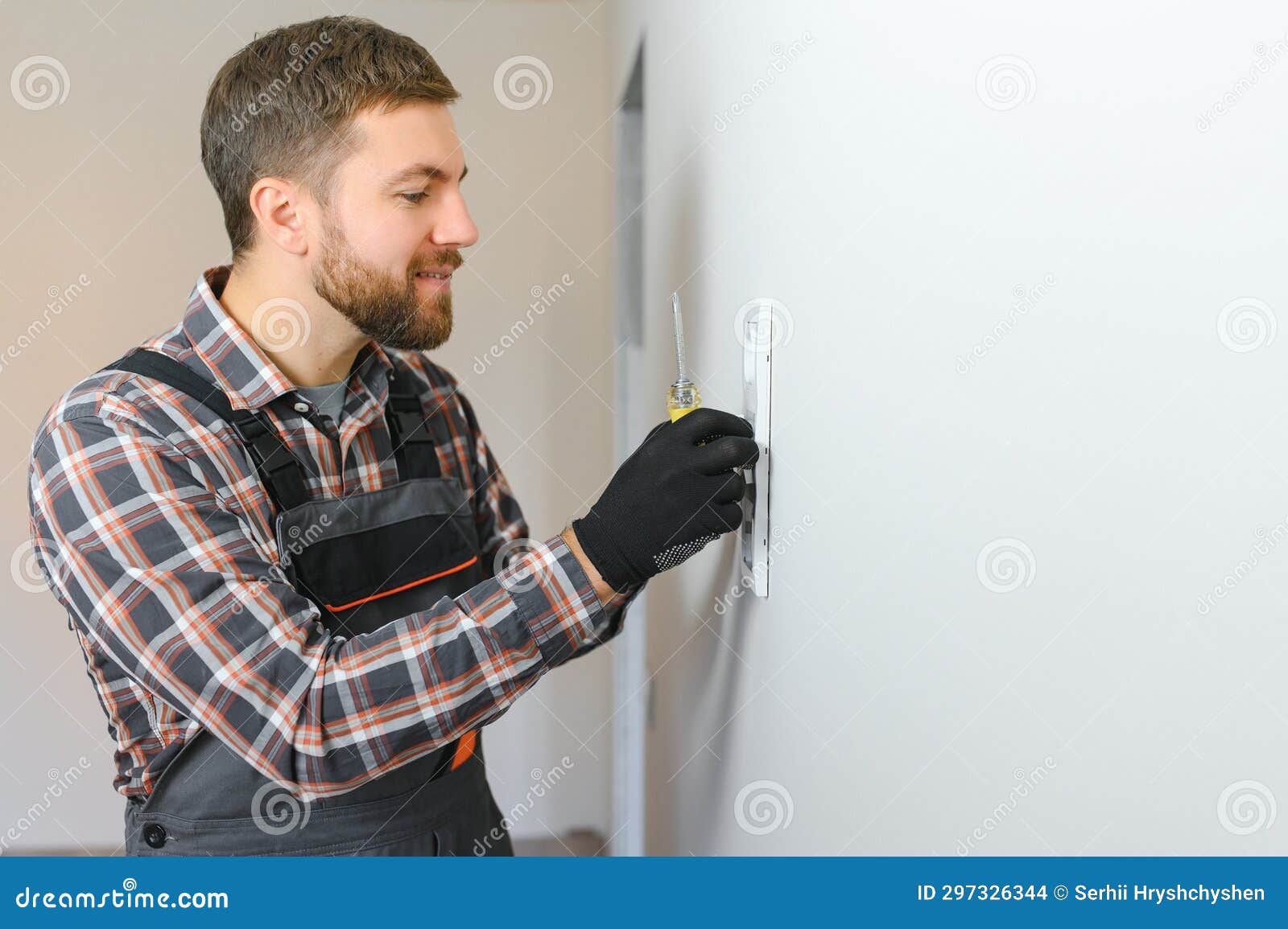 Confident Professional Electrician in Uniform Using Screwdriver while ...