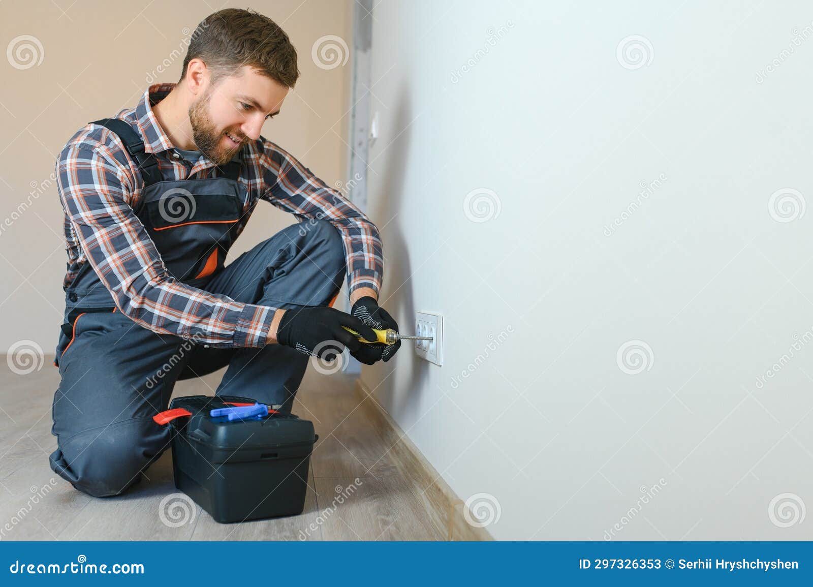 Confident Professional Electrician in Uniform Using Screwdriver while ...