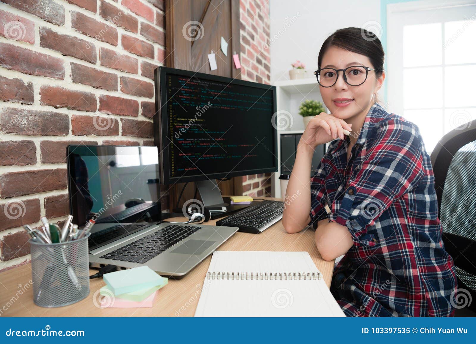 A Female Programmer Typing Source Codes And Using Mobile Phone In A ... A Female Programmer Typing Source Codes And Using Mobile Phone In A ...