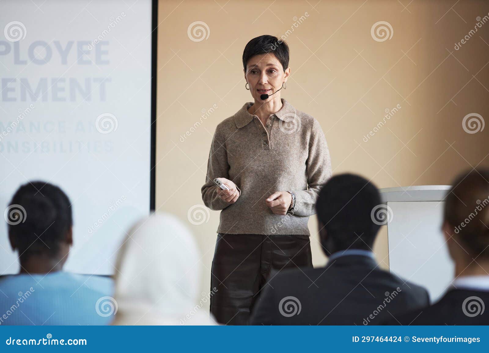 Confident Professional Standing in Front of Audience during ...