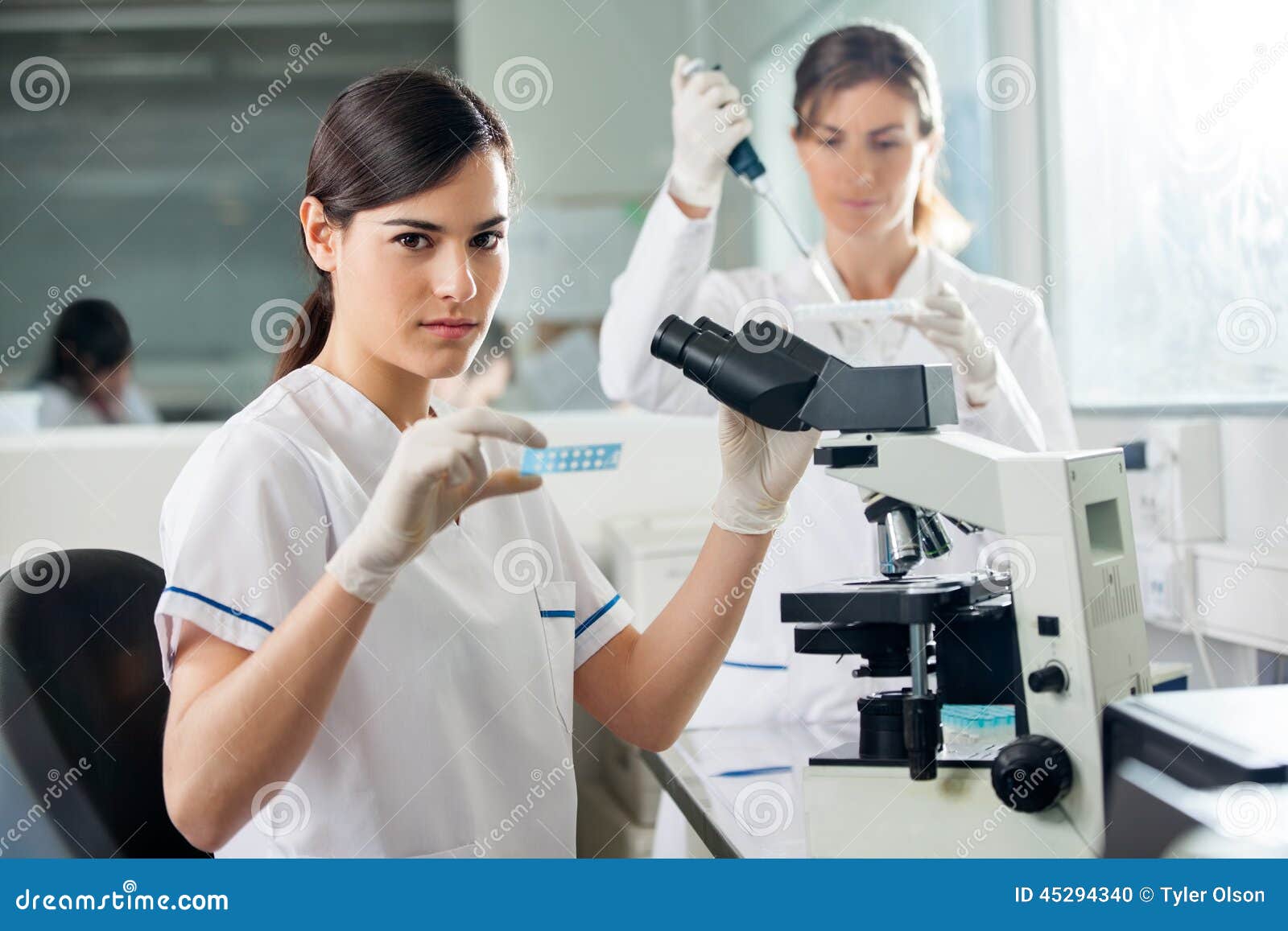 Confident Researcher Using Microscope in Lab Stock Photo - Image of ...