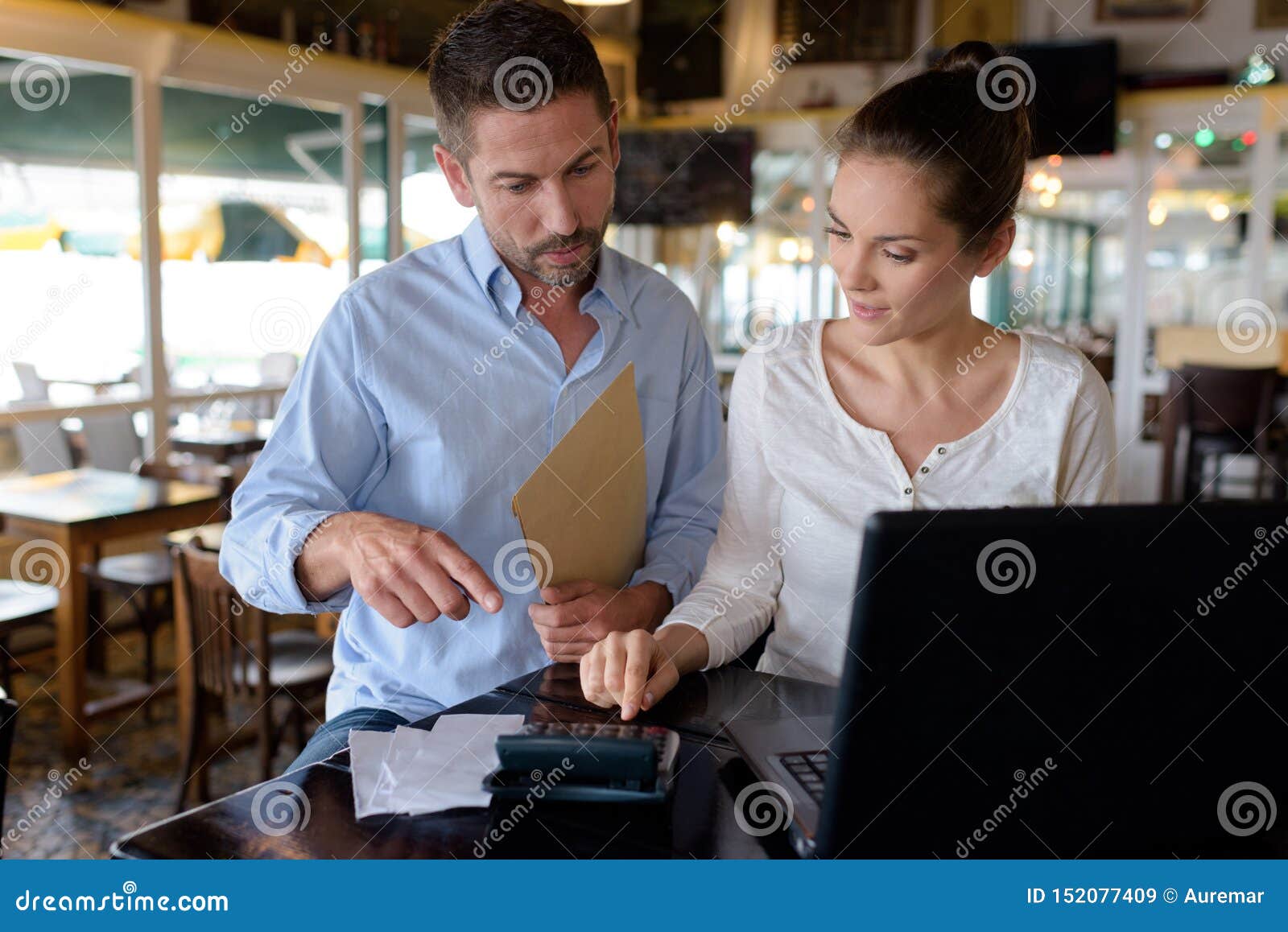Confident Restaurant Manager Assisting New Employee Stock Image - Image ...