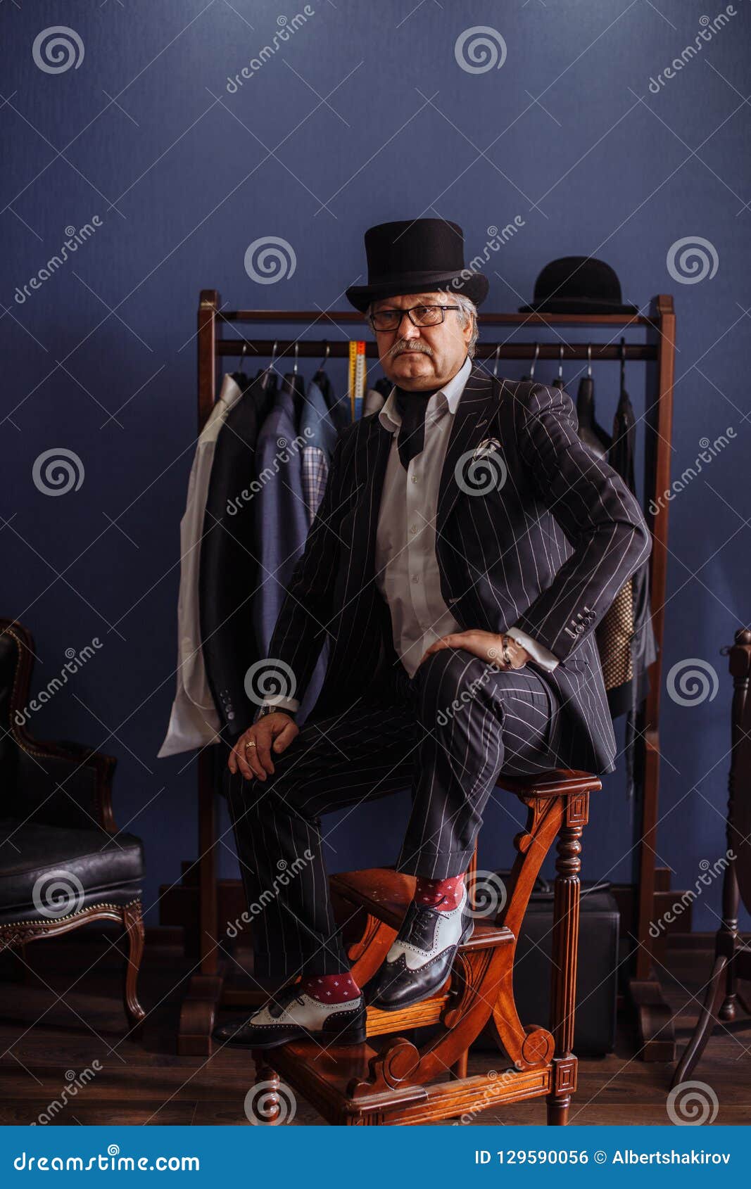 Confident Retro Style Fashion Man Sitting on Wooden Stool Tailor`s ... Confident Retro Style Fashion Man Sitting on Wooden Stool Tailor`s ...