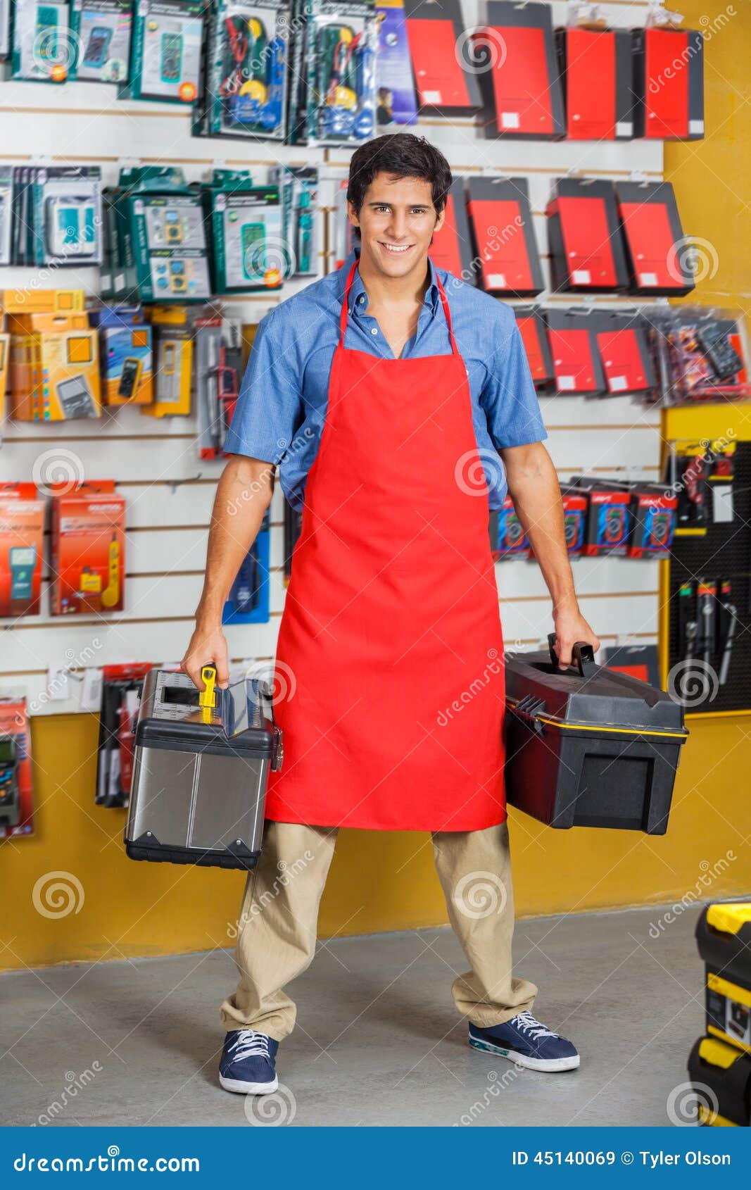 Confident Salesman Holding Toolboxes in Store Stock Image - Image of ...