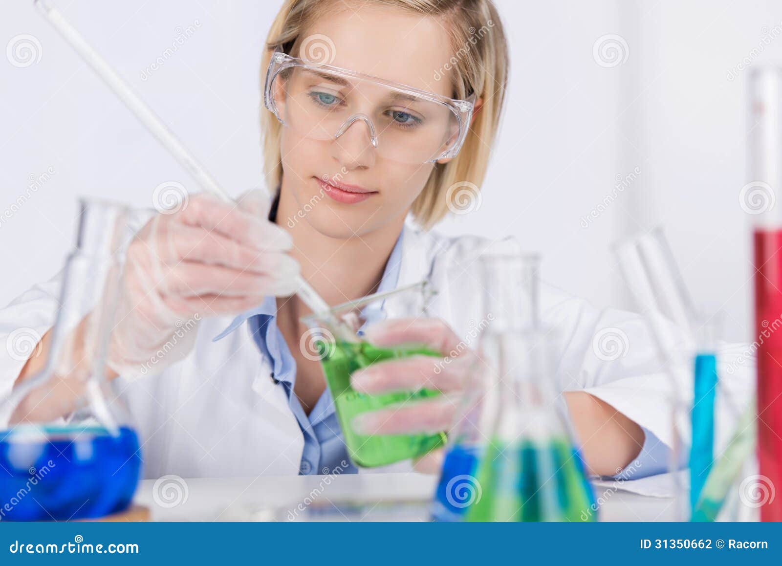 Confident Scientist Experimenting at Desk in Laboratory Stock Photo ...