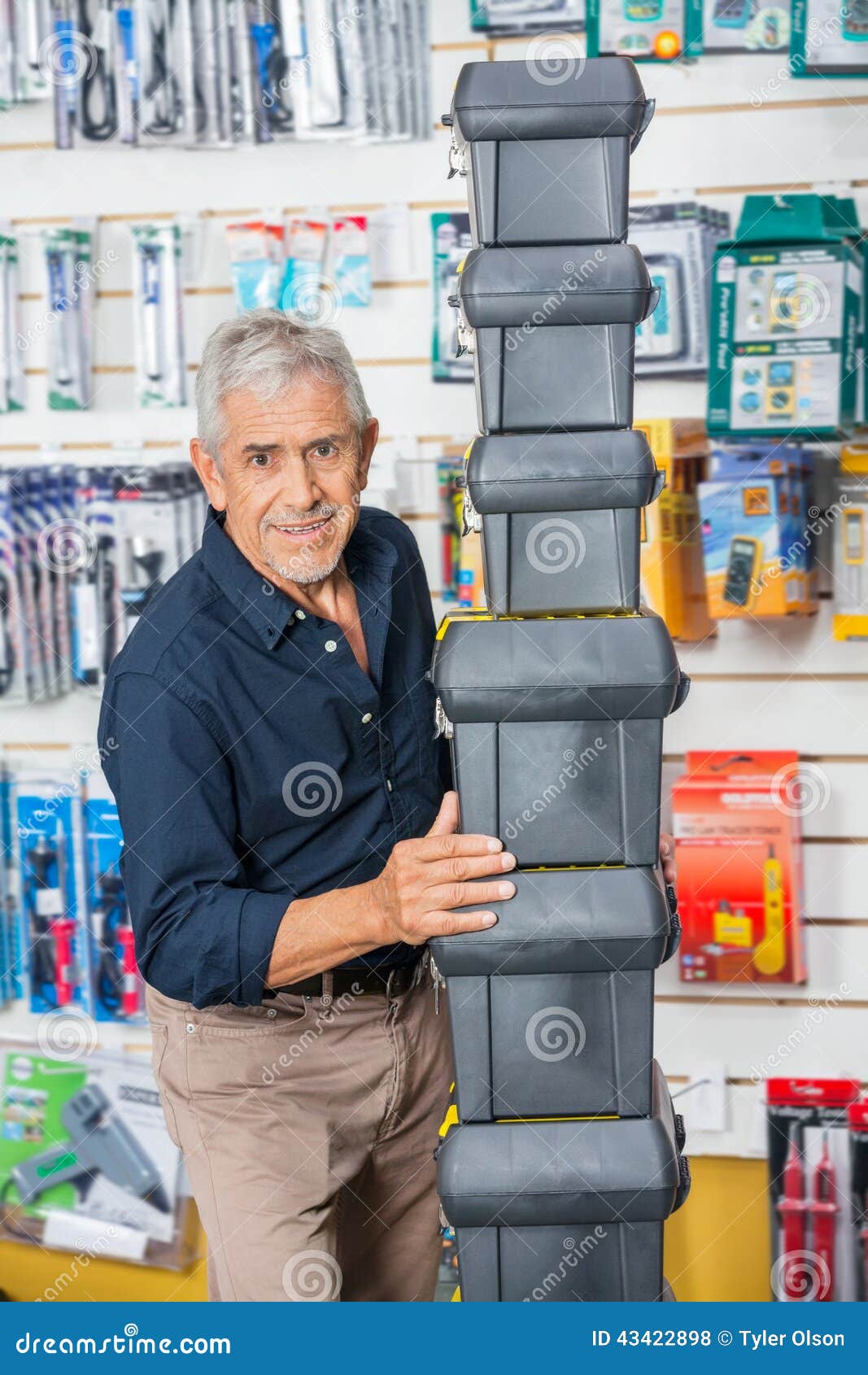 Confident Senior Man Stacking Toolboxes in Store Stock Photo - Image of ...