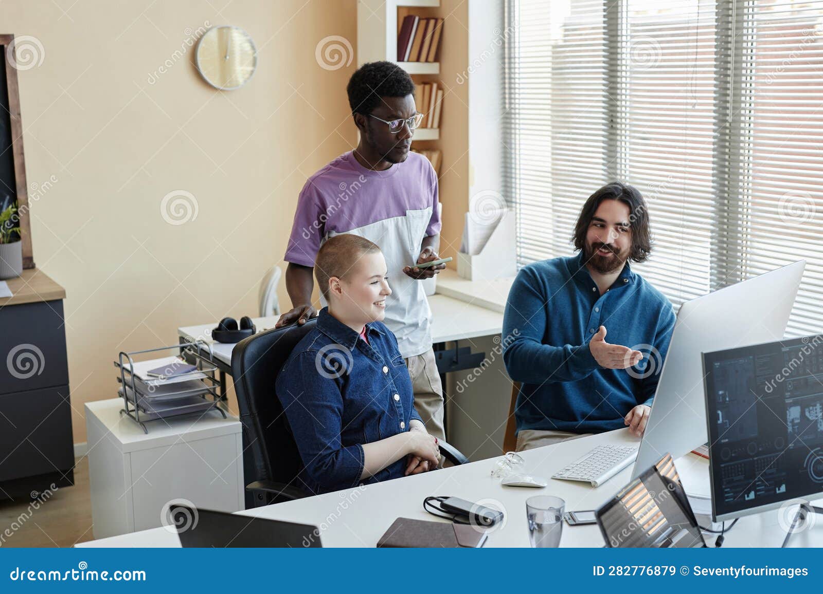 Confident Smiling Businessman Pointing at Computer Screen during ...