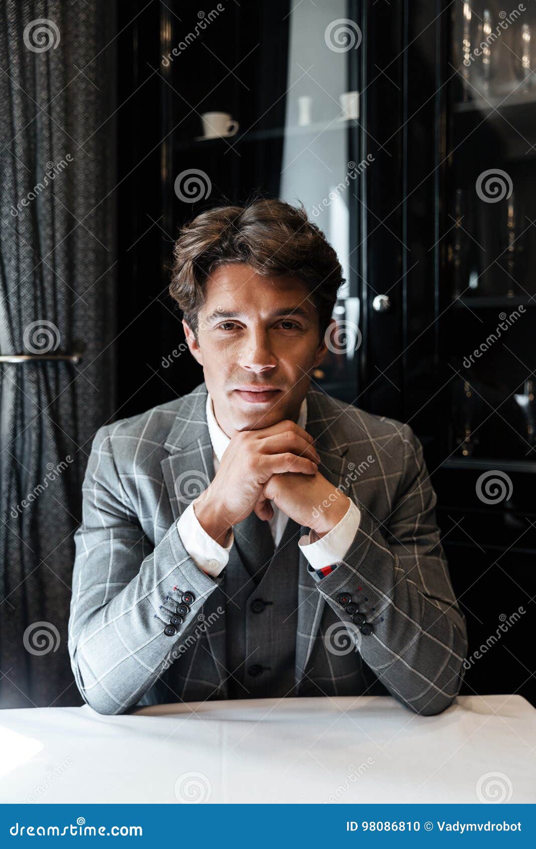 Confident Smiling Businessman in Suit Sitting at the Table Stock Photo ...