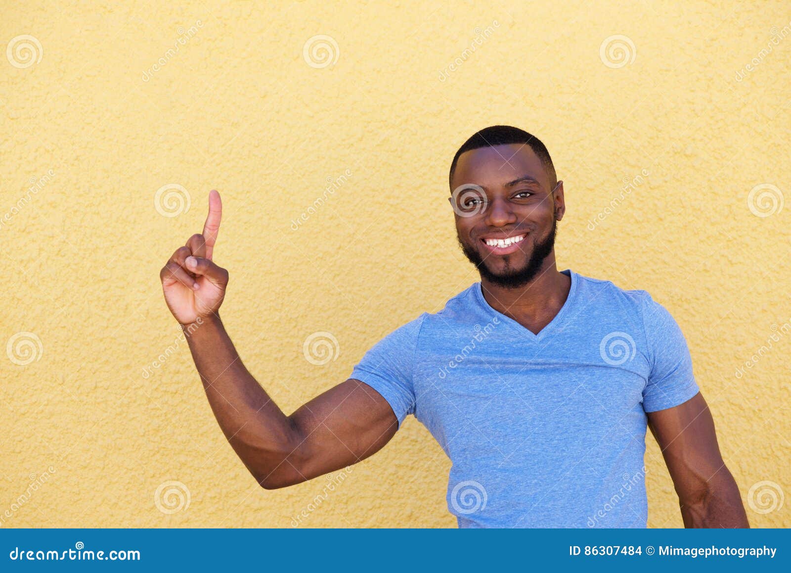 Confident Smiling Man Pointing Finger Up Stock Photo - Image of adult ...