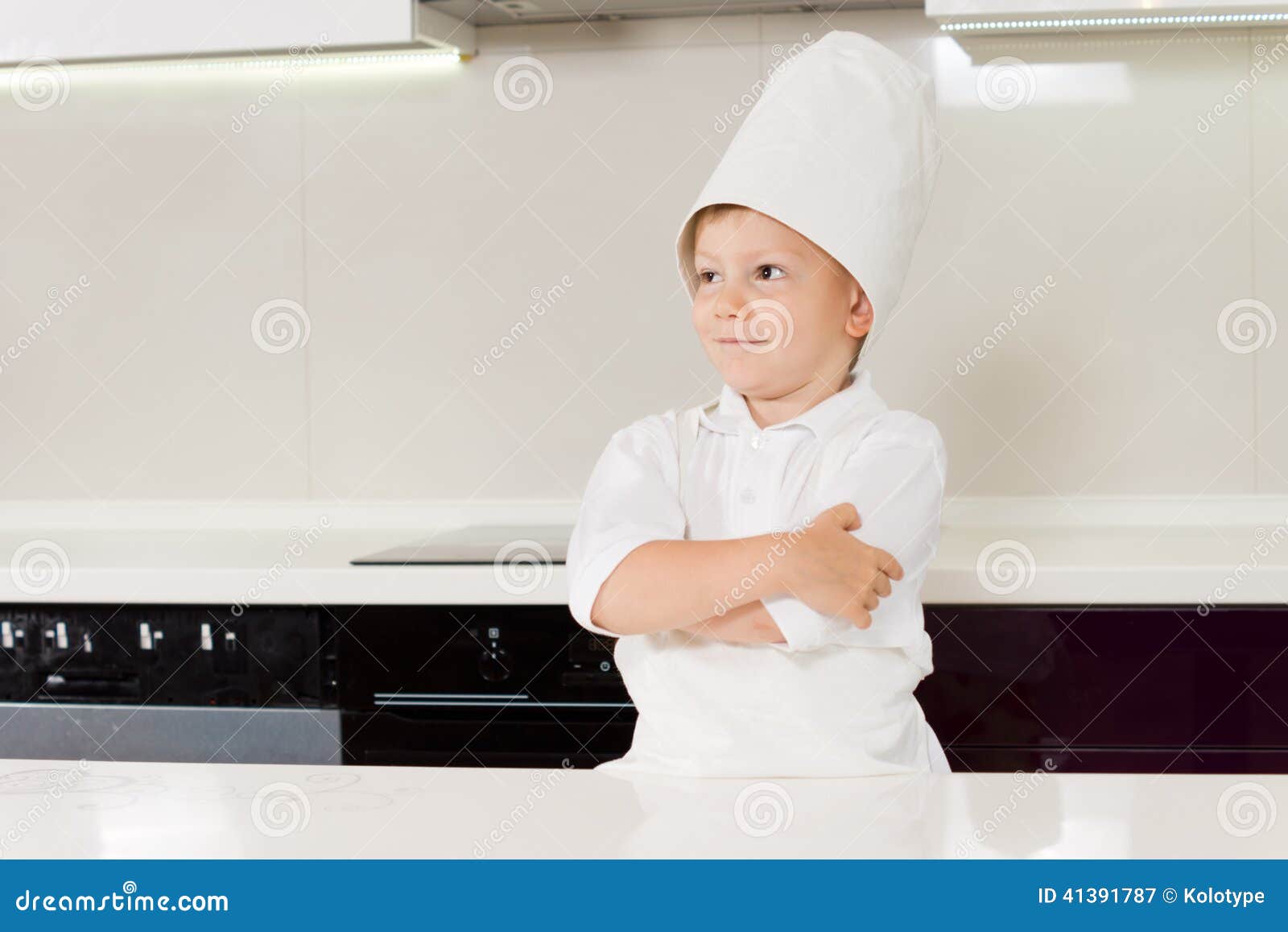 Confident Smiling Young Boy in a Chefs Uniform Stock Image - Image of ...