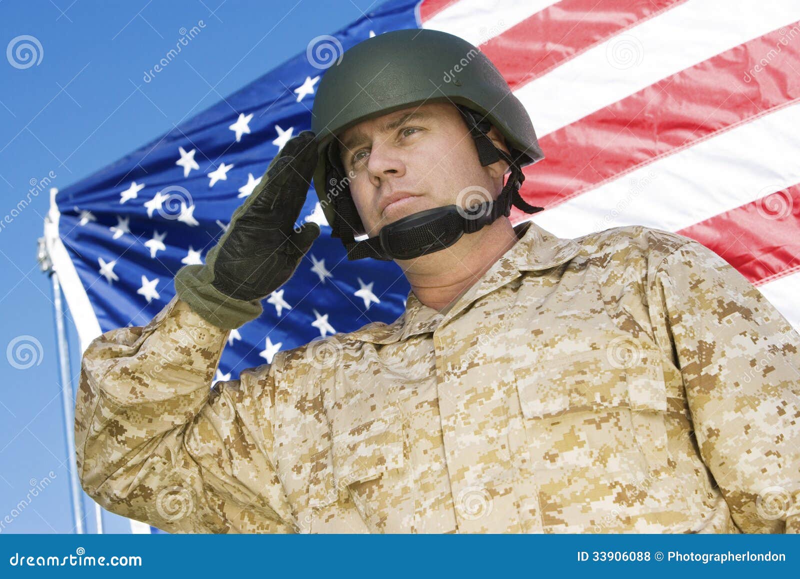 Confident Soldier Saluting in Front of American Flag Stock Photo ...