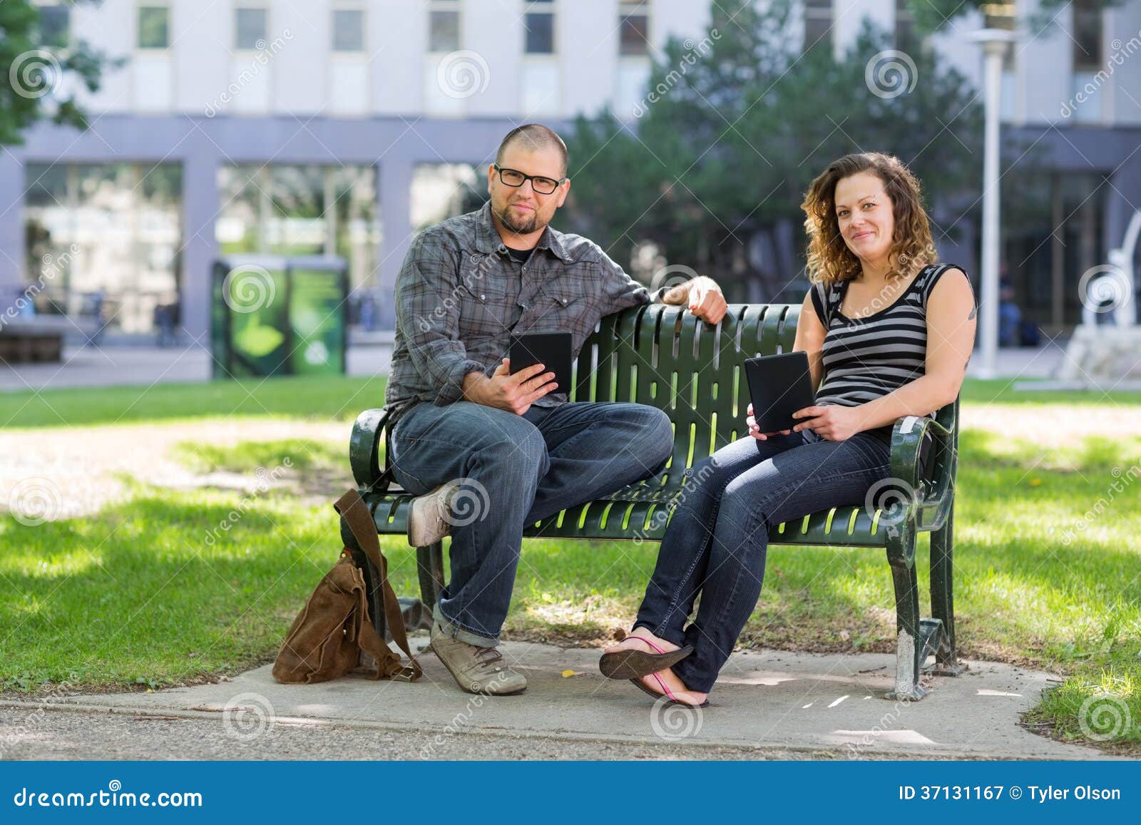 Confident Students Sitting on Bench at University Stock Image - Image ...