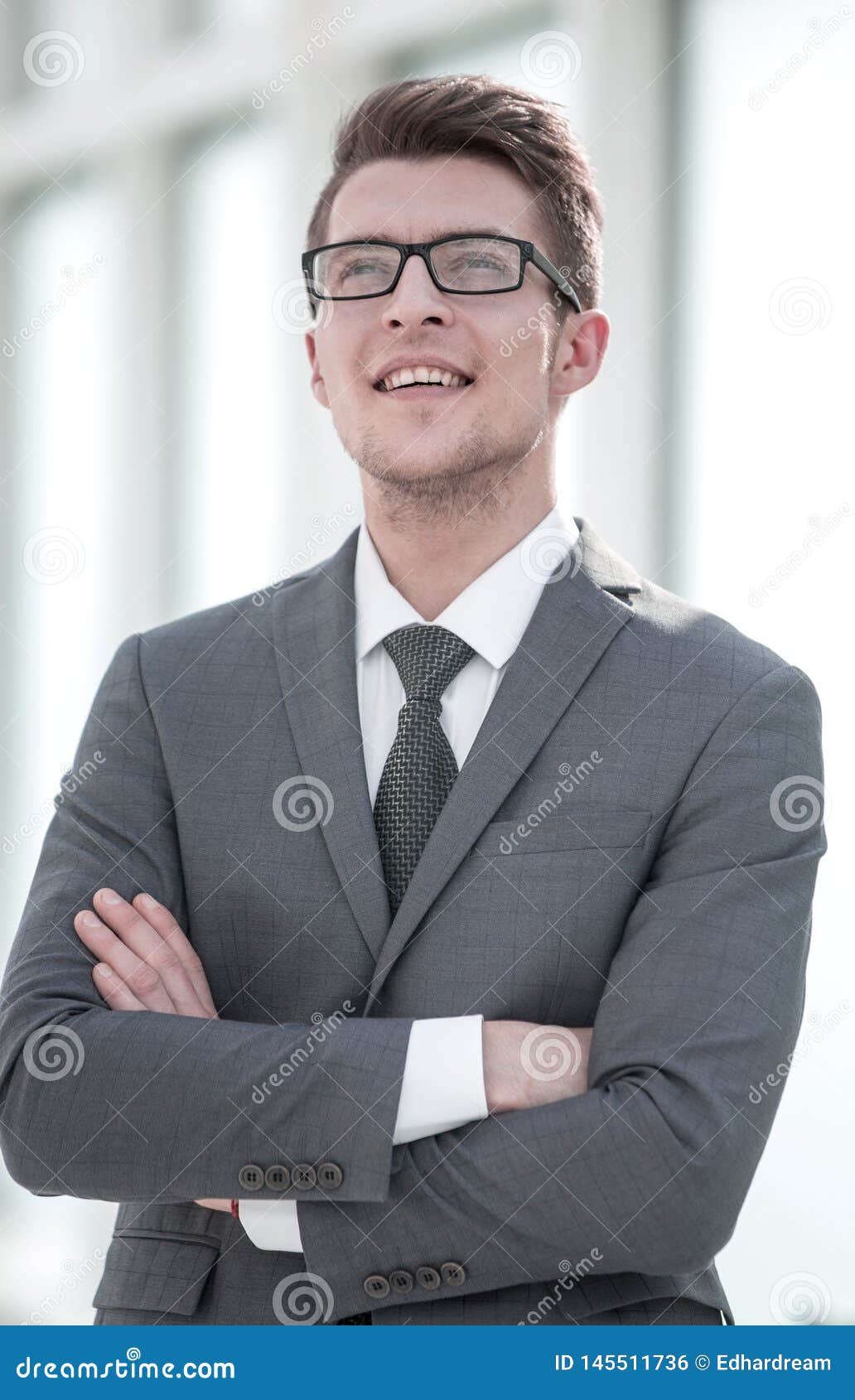 Confident Successful Young Businessman Standing in the Office Stock ... Confident Successful Young Businessman Standing in the Office Stock ...