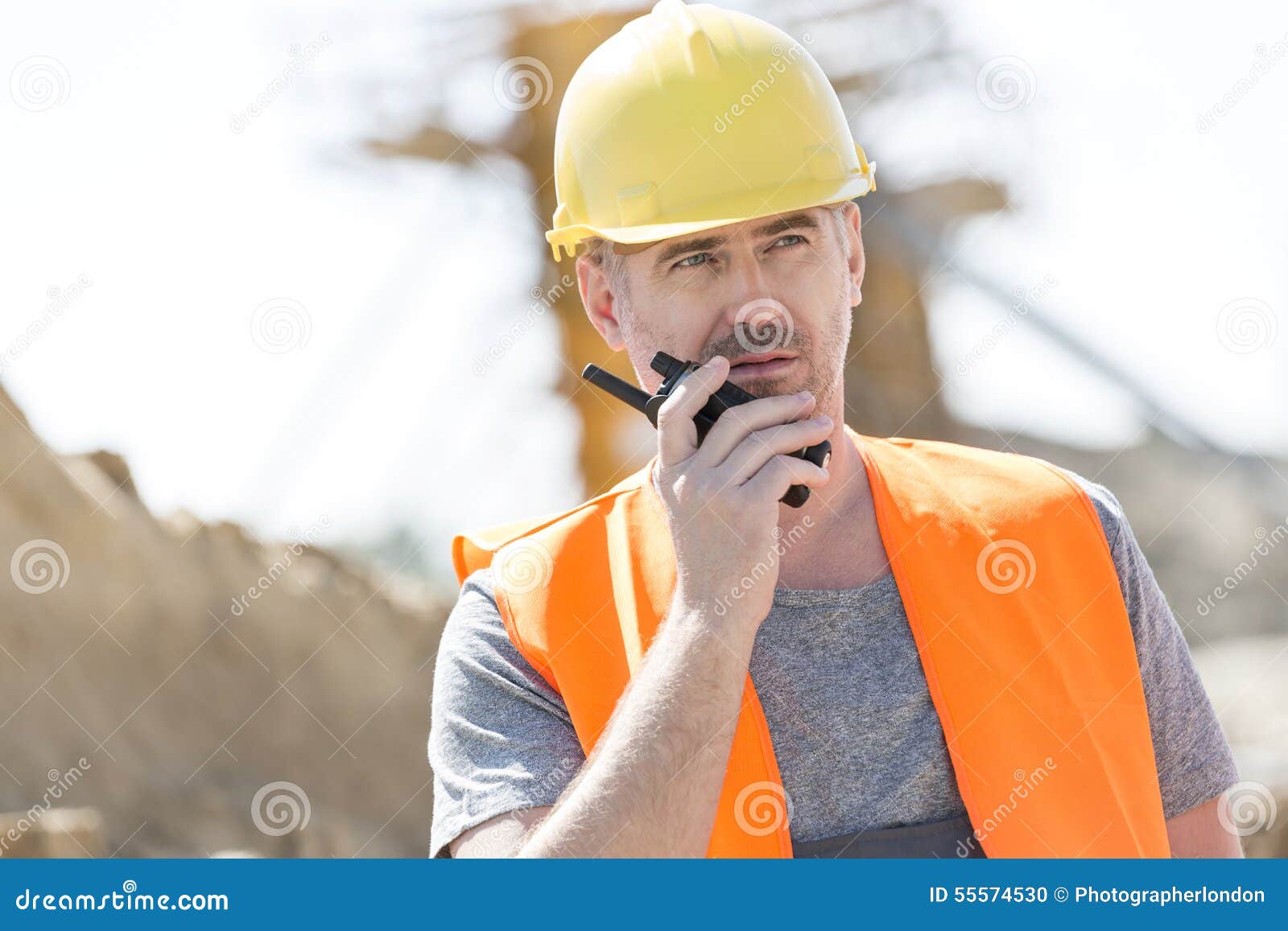 Confident Supervisor Using Walkie-talkie at Construction Site Stock ...