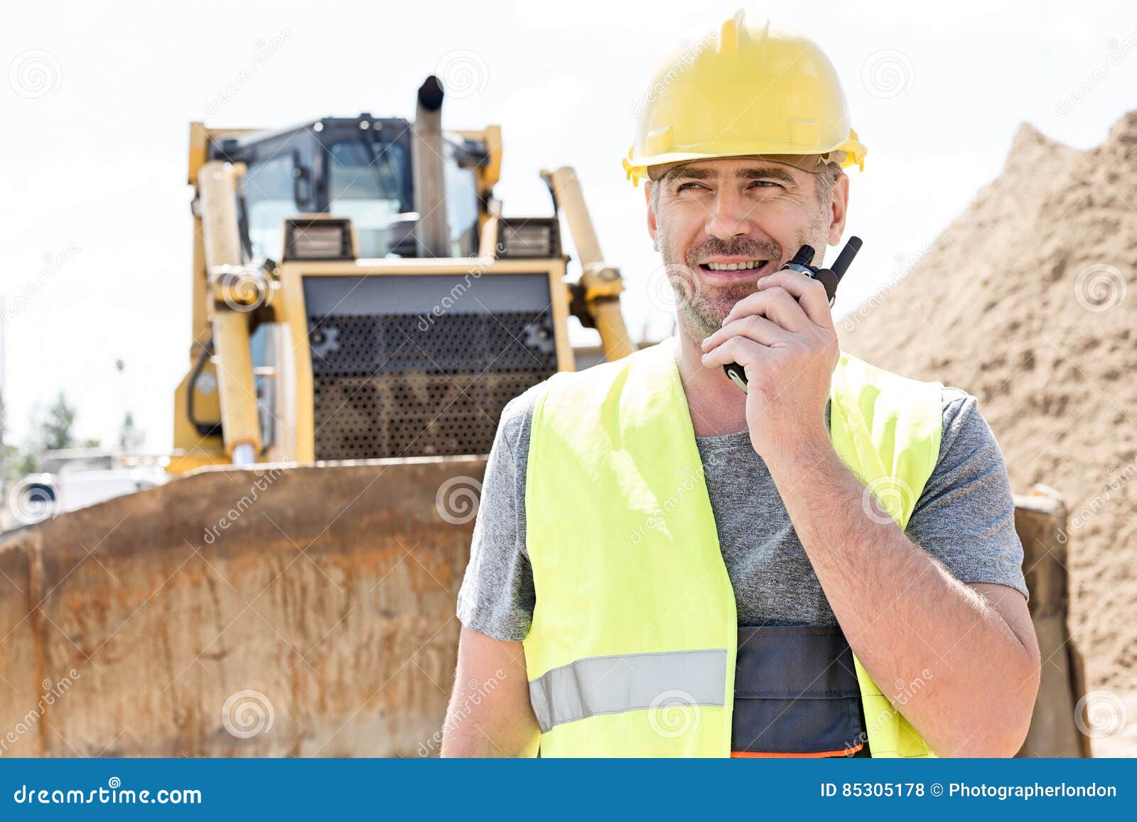 Confident Supervisor Using Walkie-talkie at Construction Site Stock ...