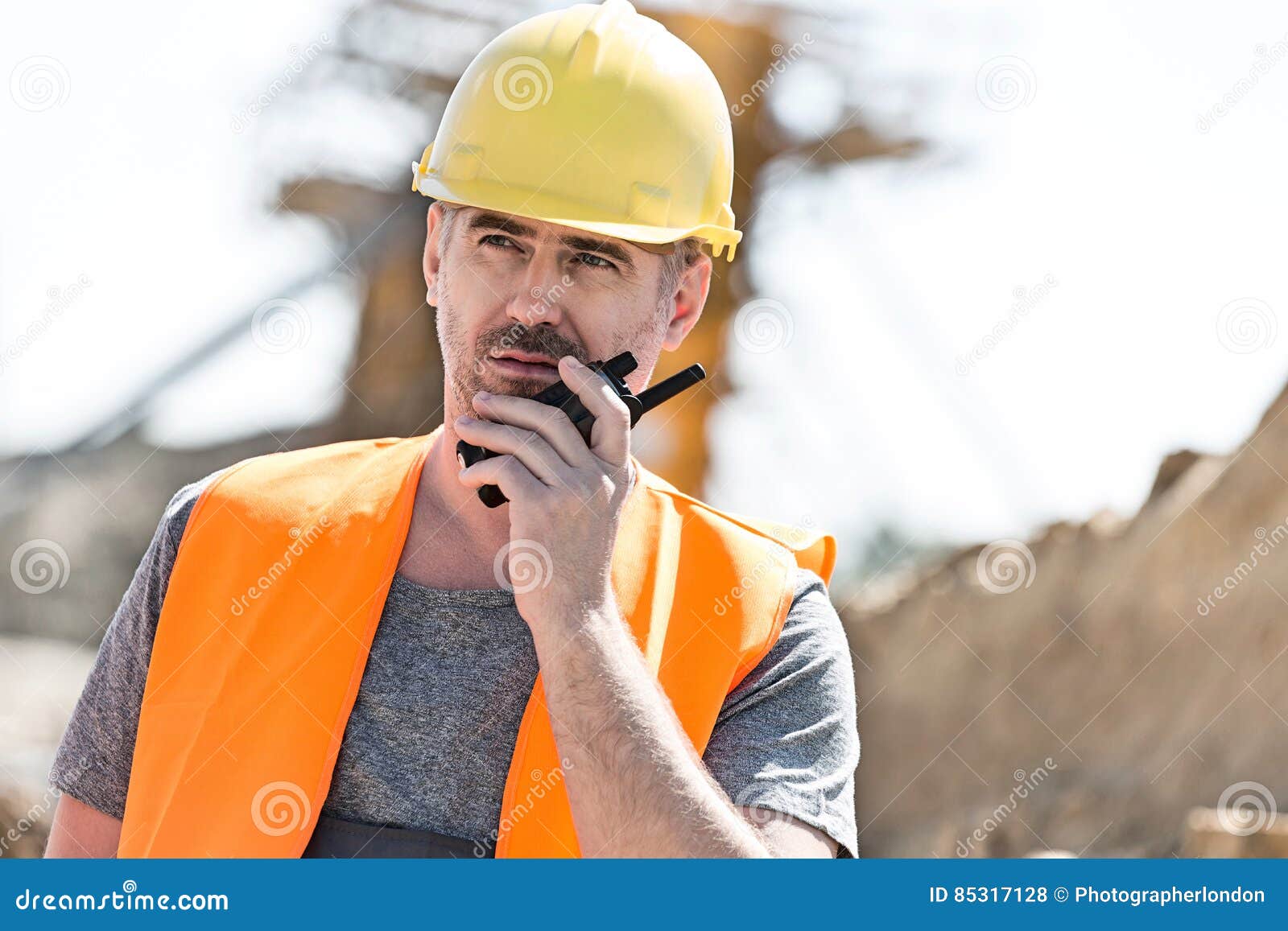 Confident Supervisor Using Walkie-talkie at Construction Site Stock ...