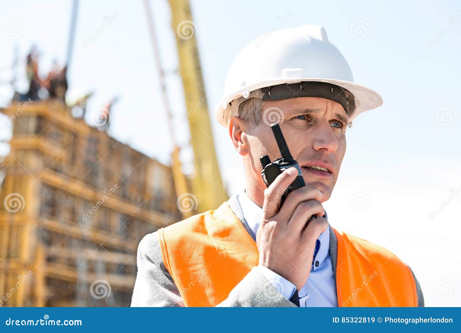 Confident Supervisor Using Walkie-talkie at Construction Site Stock ...
