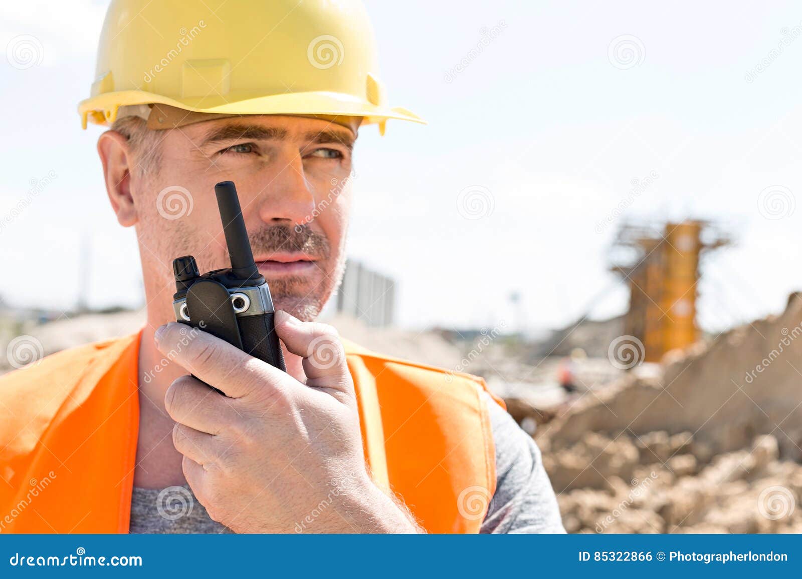 Confident Supervisor Using Walkie-talkie at Construction Site Stock ...