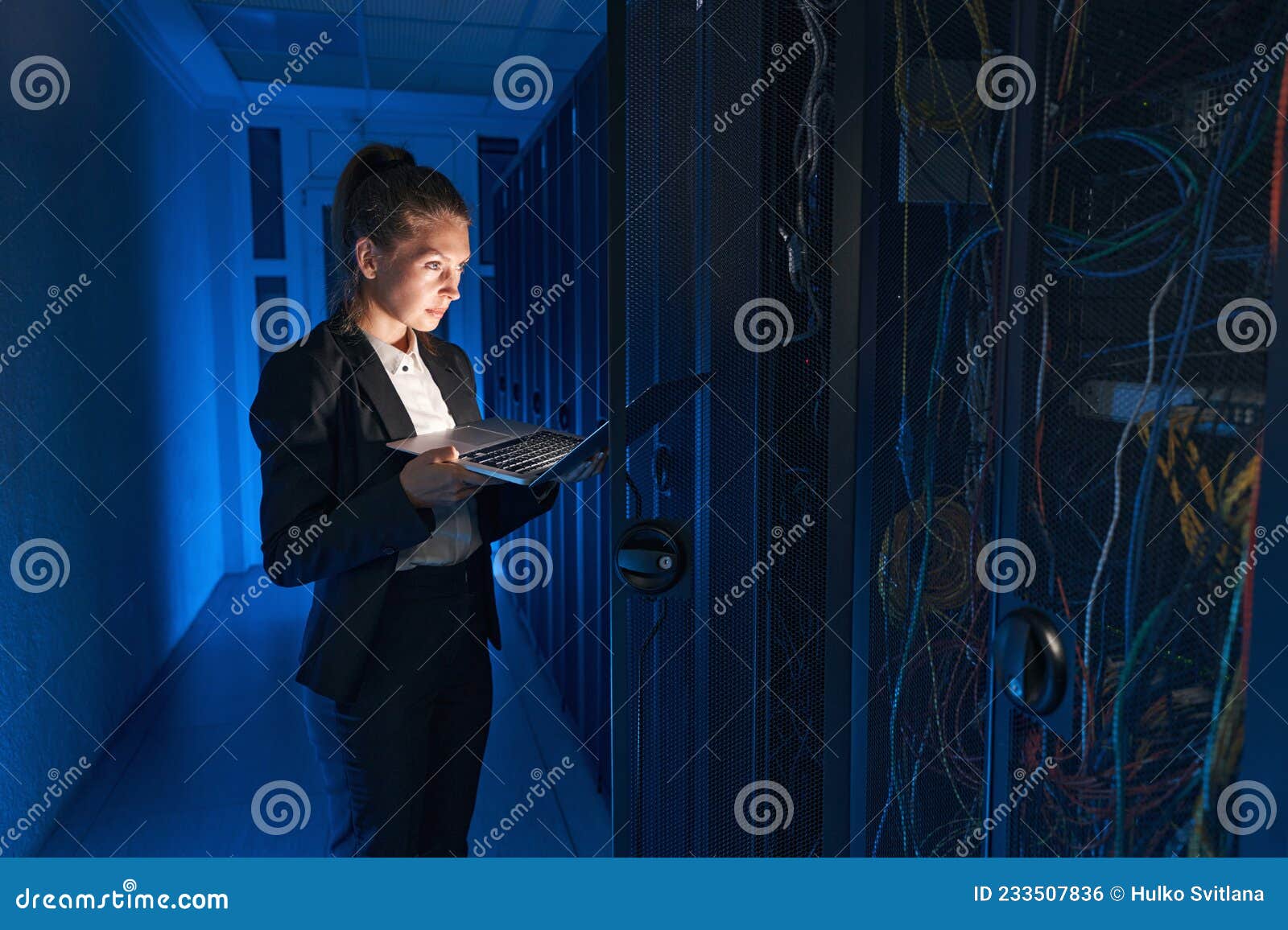 Confident System Administrator Working on Laptop in Data Center Stock ...