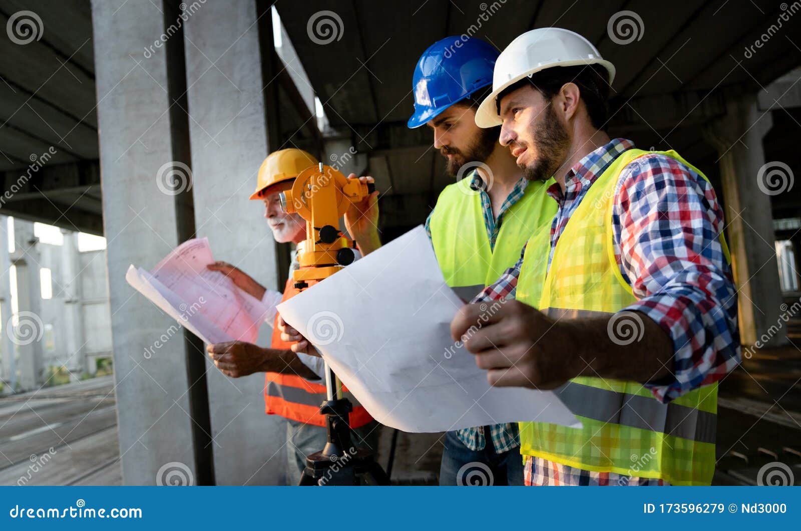 Confident Team of Architects and Engineers Working Together on ...