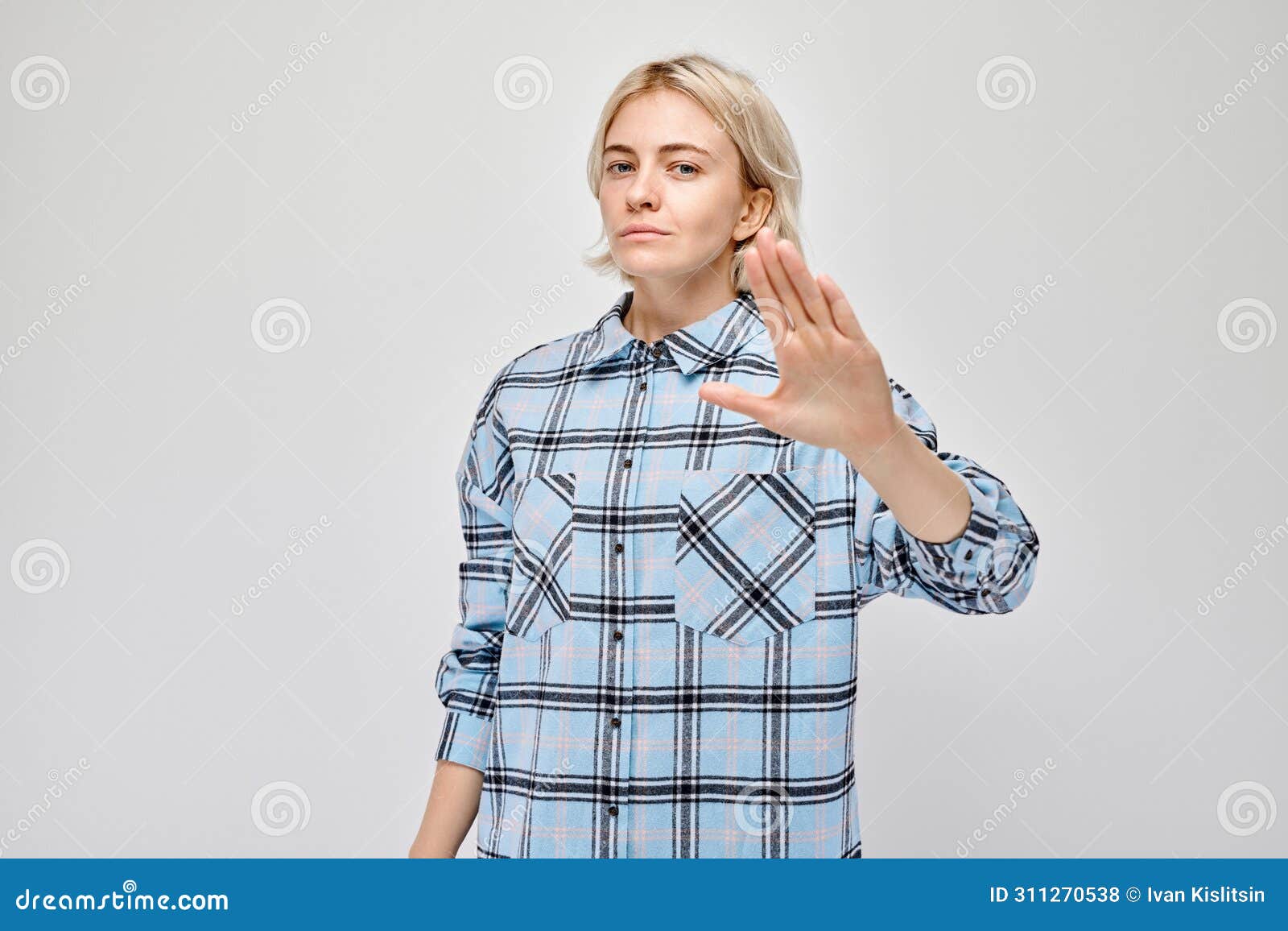 Confident Woman Gesturing Stop with Hand, Signaling Boundaries or ...