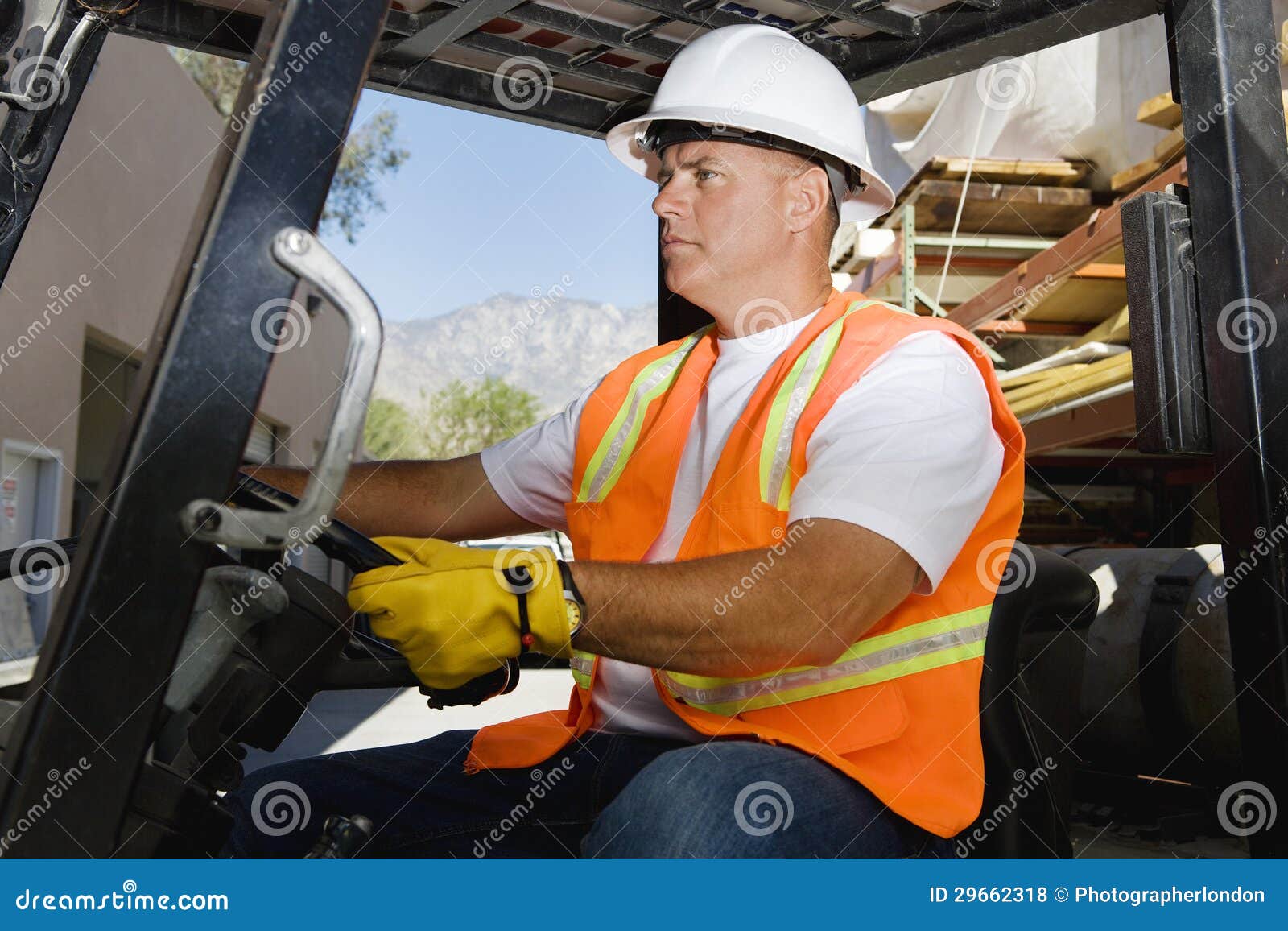 Confident Worker Driving Forklift at Workplace Stock Photo - Image of ...