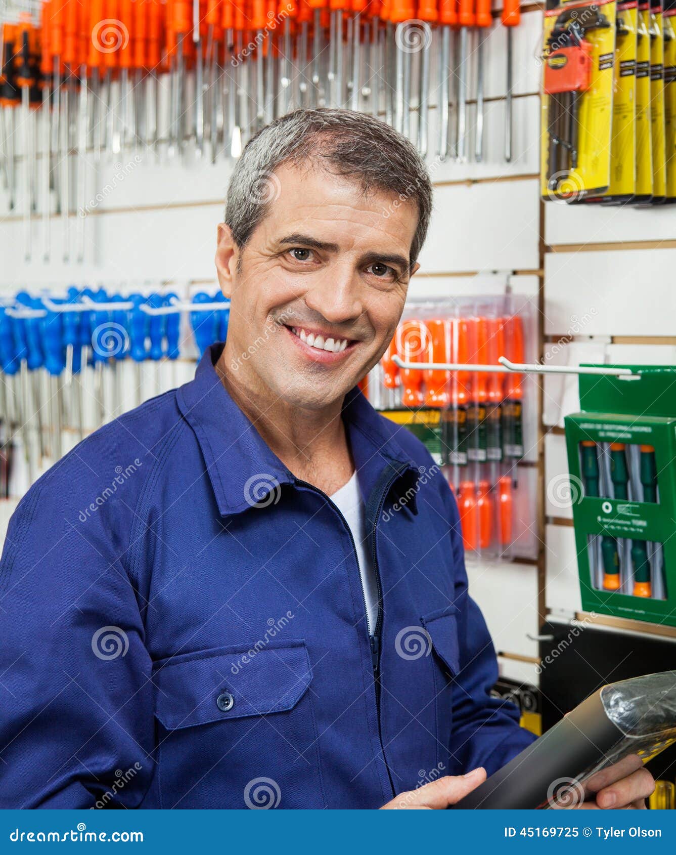 Confident Worker Holding Product in Hardware Store Stock Image - Image ...