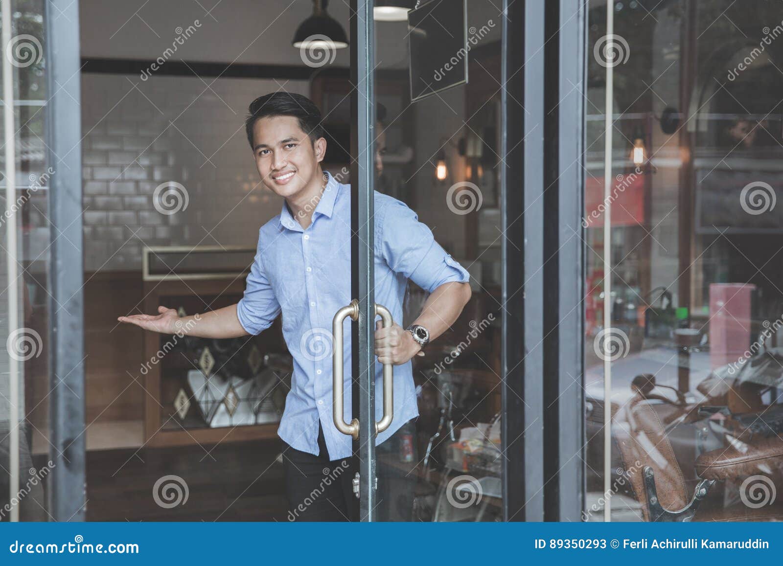 Young Barber Expert Smiling Welcoming Customer To His Barbershop Stock ... Young Barber Expert Smiling Welcoming Customer To His Barbershop Stock ...