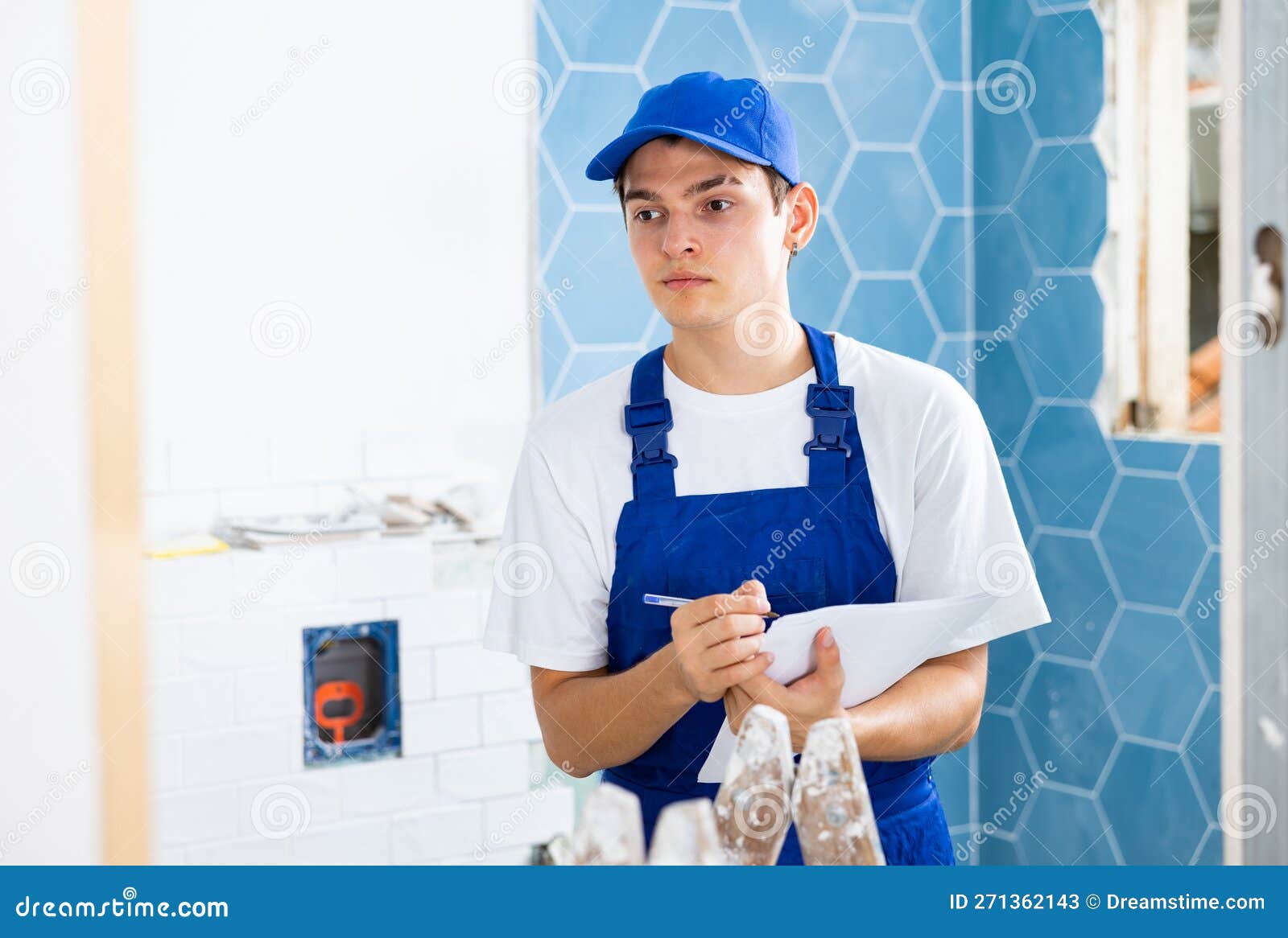Young Builder Making Checklist while Planning Indoor Building Overhaul ...
