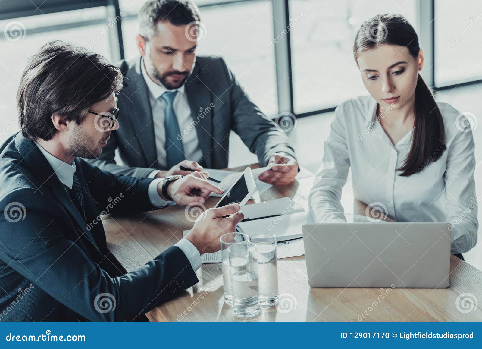 Confident Young Business Partners Working Together Stock Photo - Image ...