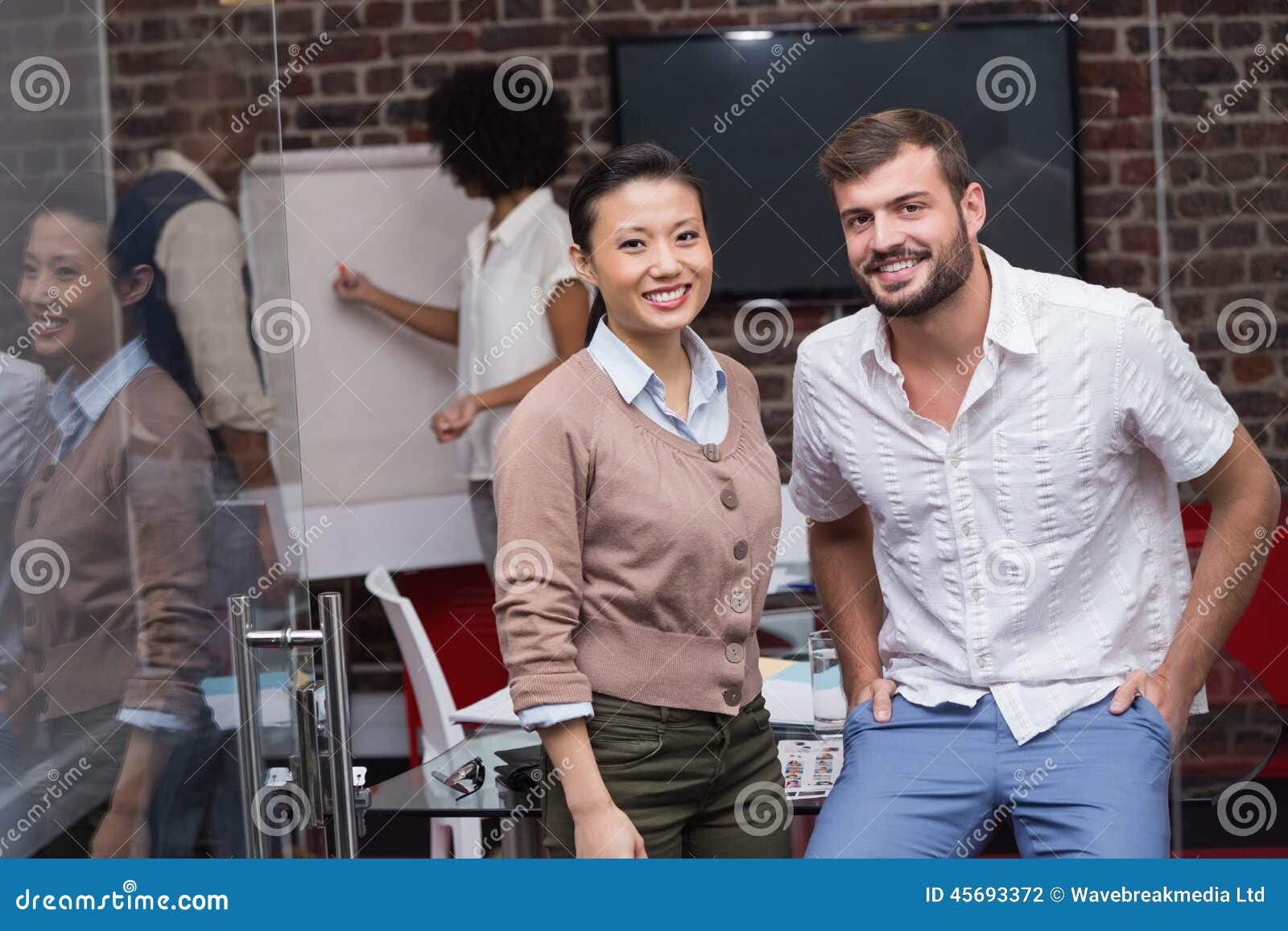 Confident Young Business People in Office Stock Photo - Image of ...
