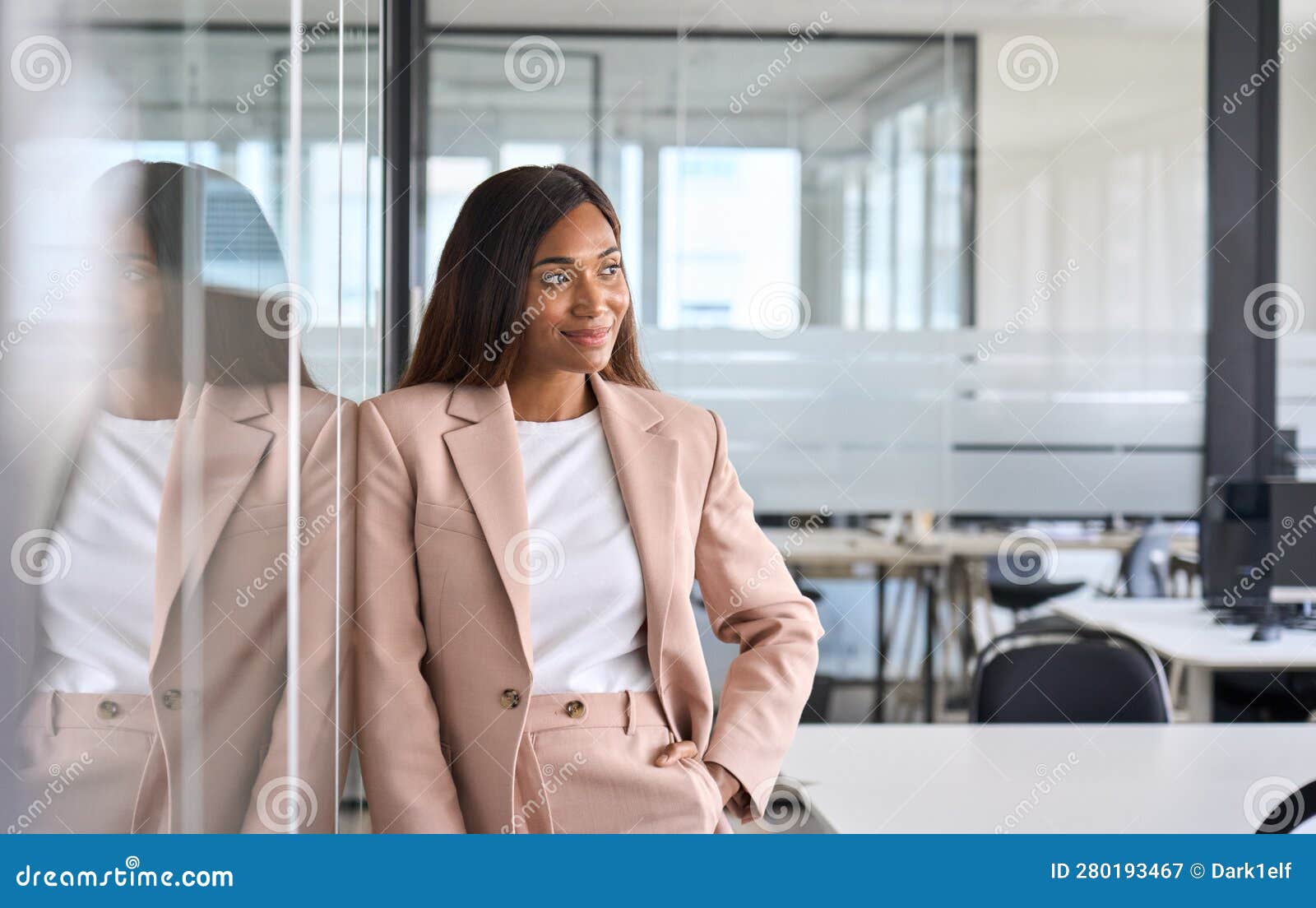 Confident Young Business Woman Standing in Office Looking Away ... Confident Young Business Woman Standing in Office Looking Away ...