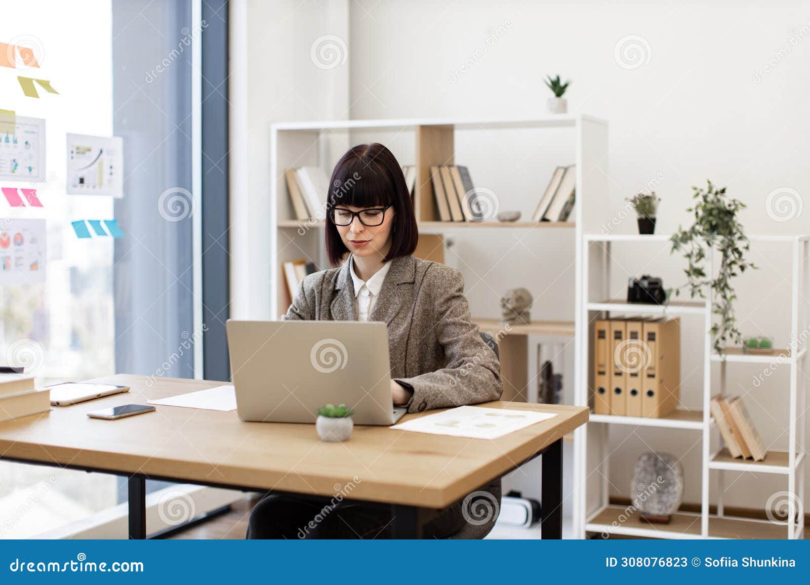Confident Young Employee in Formal Wear Unlocking Laptop Keyboard ... Confident Young Employee in Formal Wear Unlocking Laptop Keyboard ...