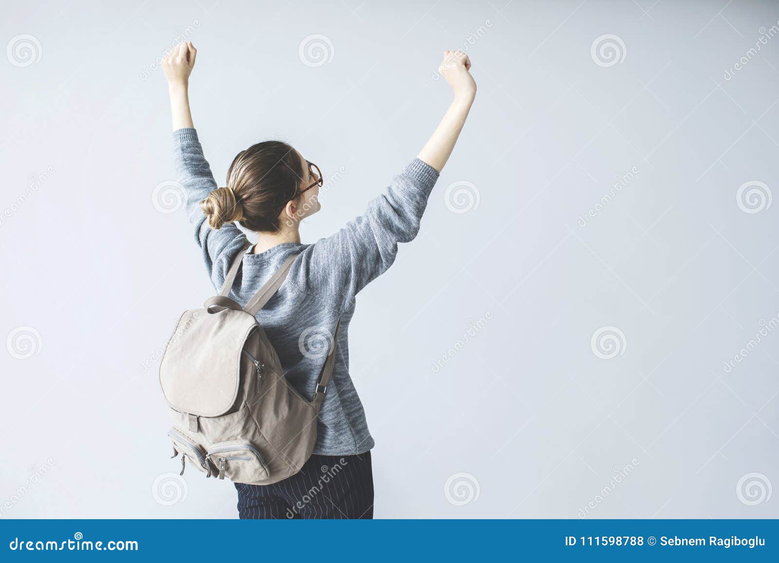 Confident Young Female Student Raised Up Arms with Backpack Stock Photo ...